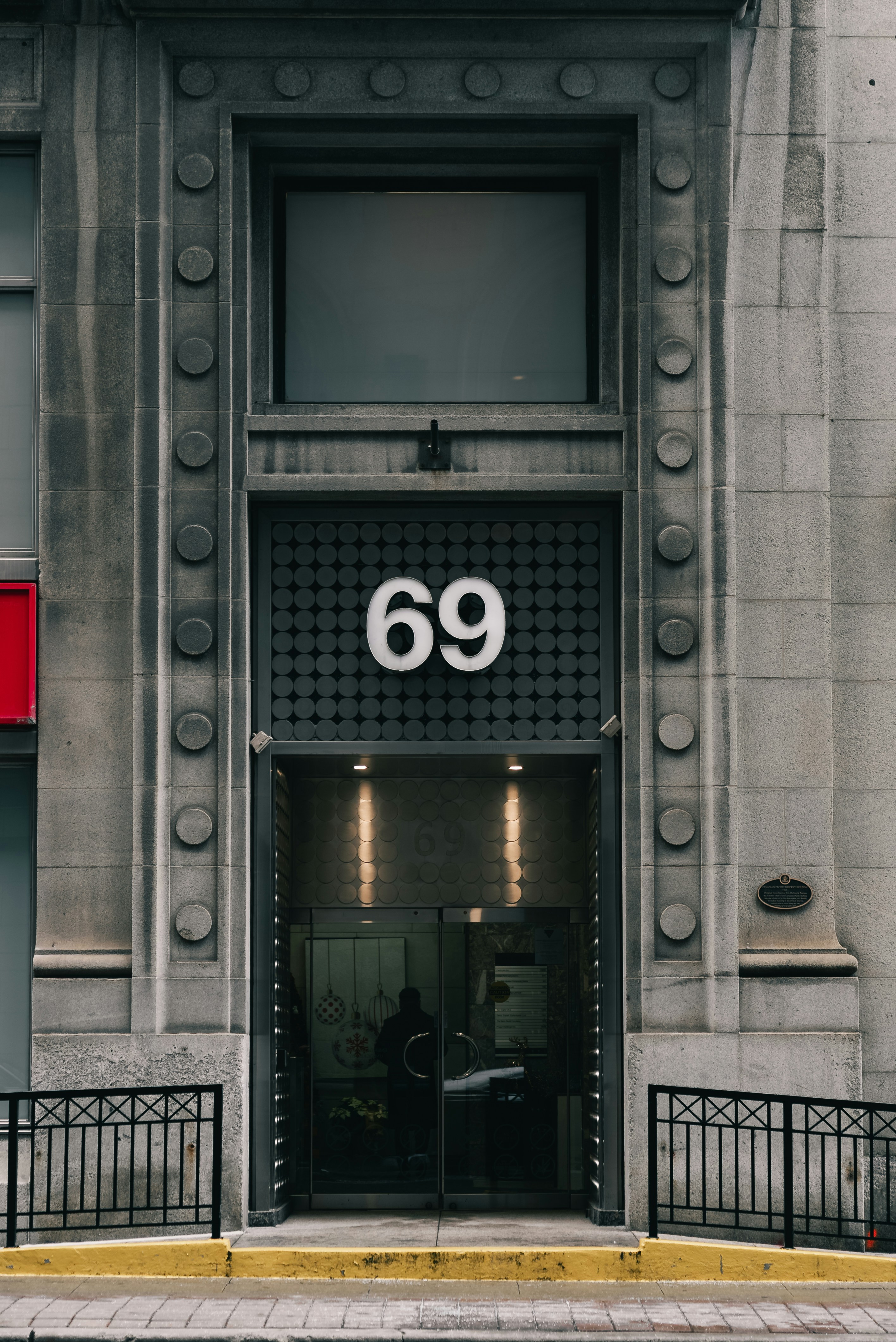 Number 69 Guards the Entrance of a City Block
