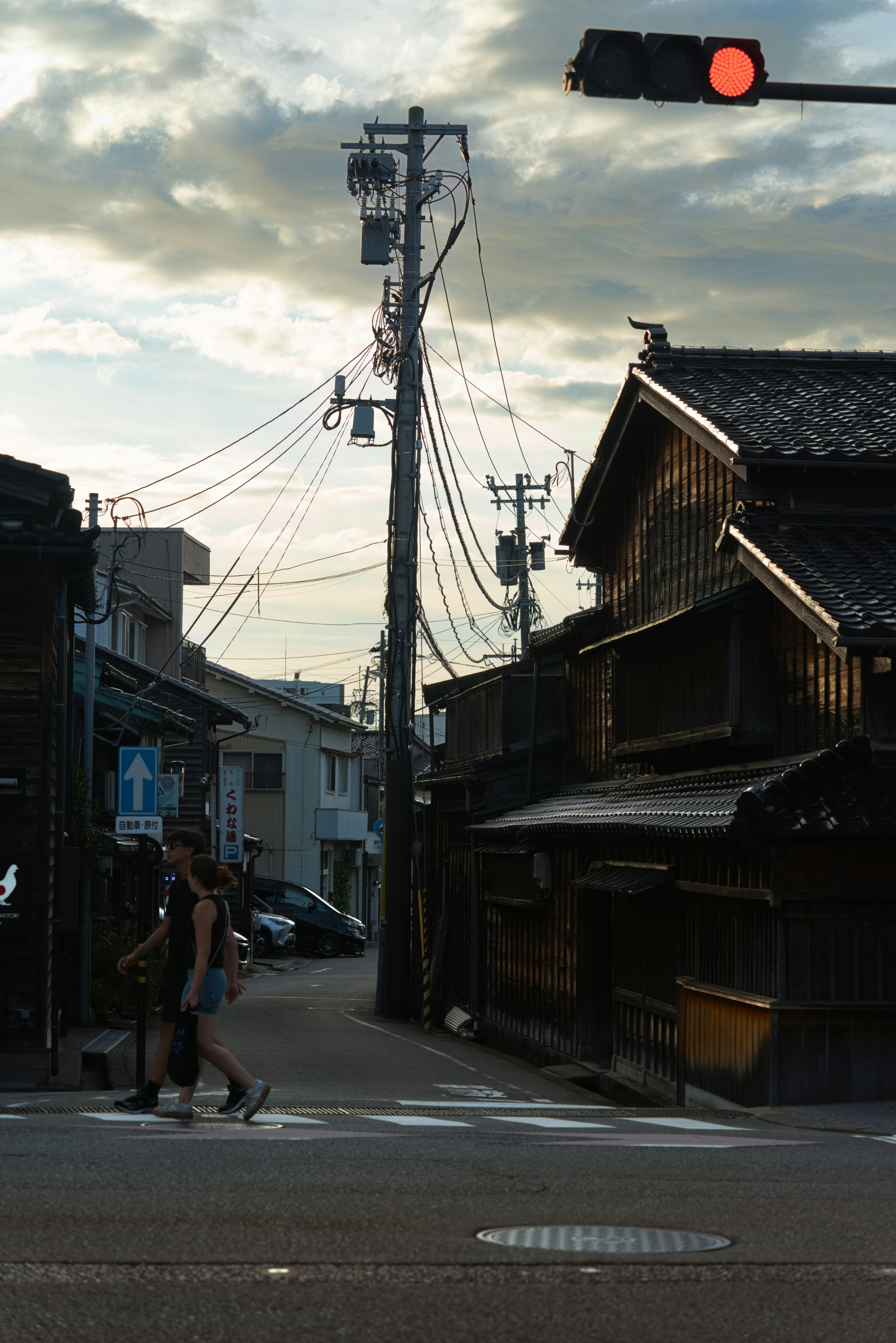 Crosswalk Confluence: A Quiet Street Between Old Wood and Modern Wires