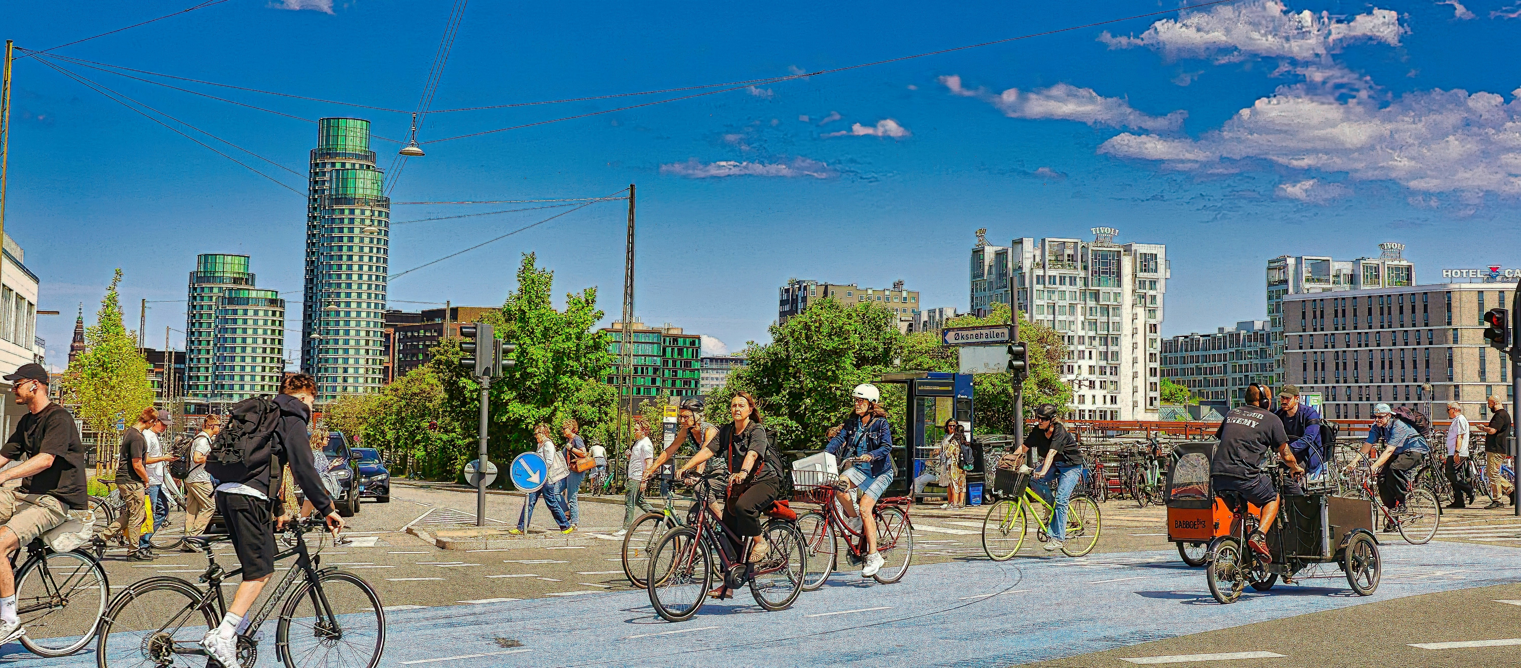 Riverside Crossing: Bicycles, Buildings, and Blue Sky in Motion