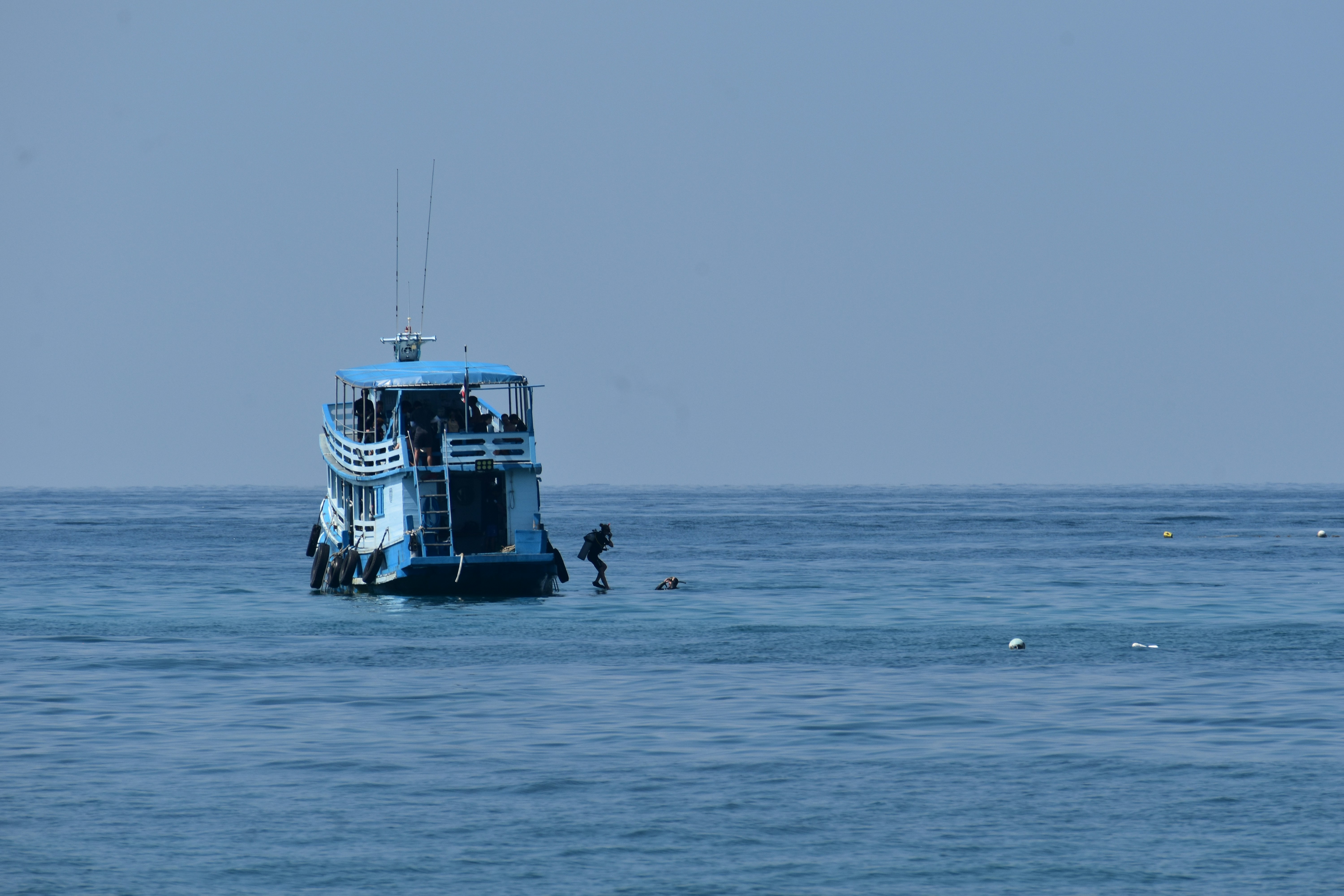 Diver jumping from boat
