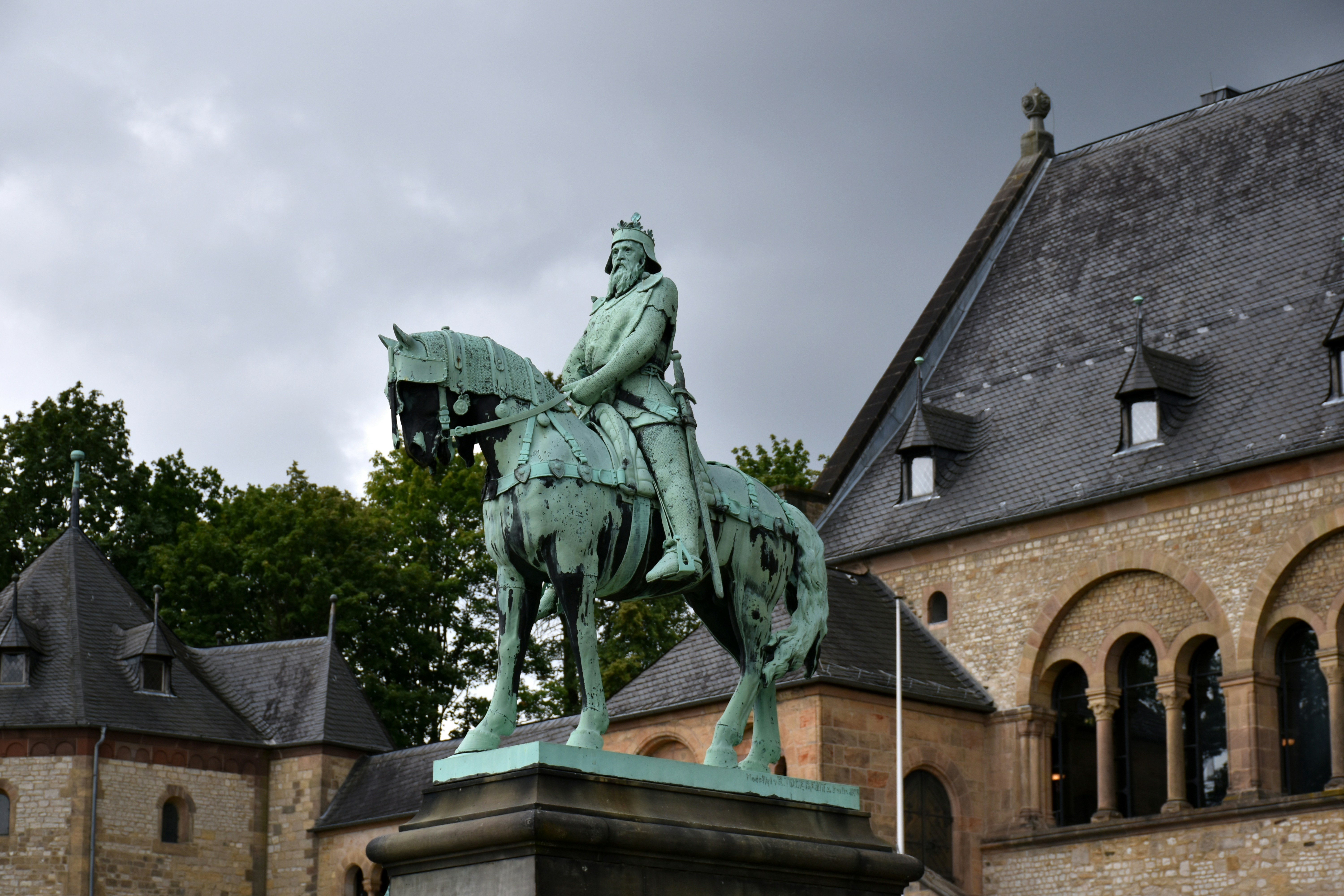 Bronze Rider on a Raised Pedestal Framed by Historic Architecture