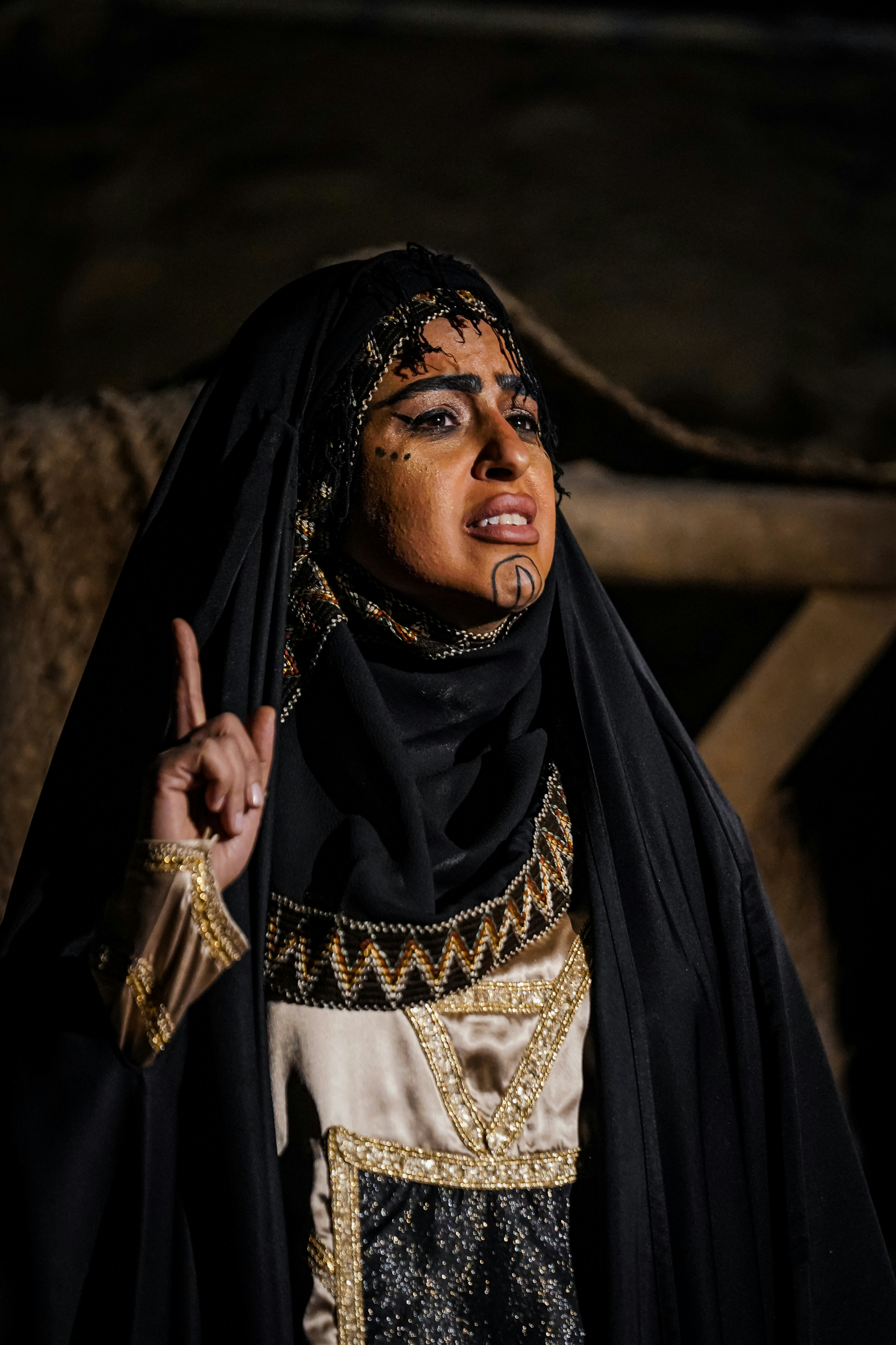 Veiled Confidence: A Portrait in Shadow and Gold
