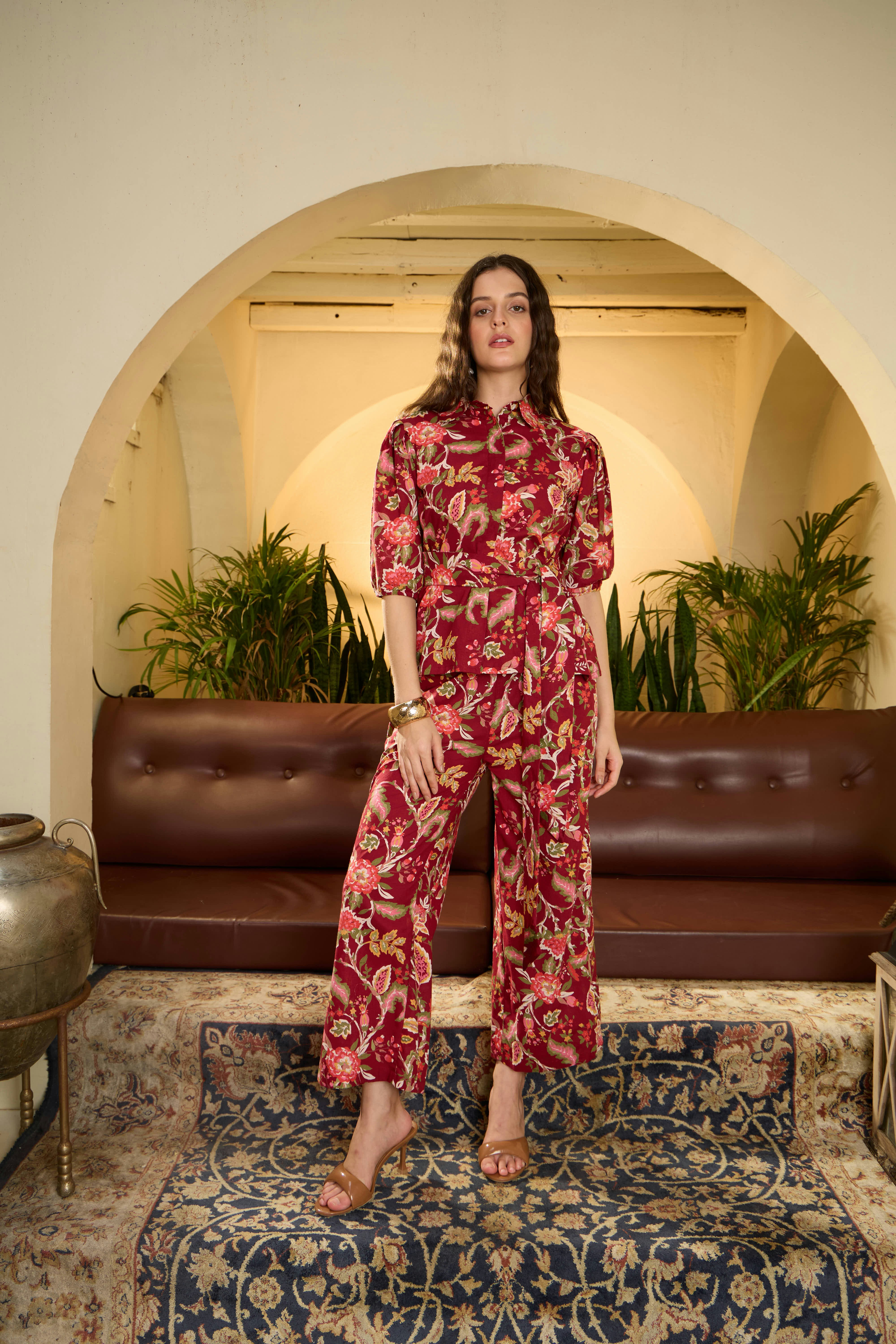 Floral Attire in a Sunlit Archway Lounge