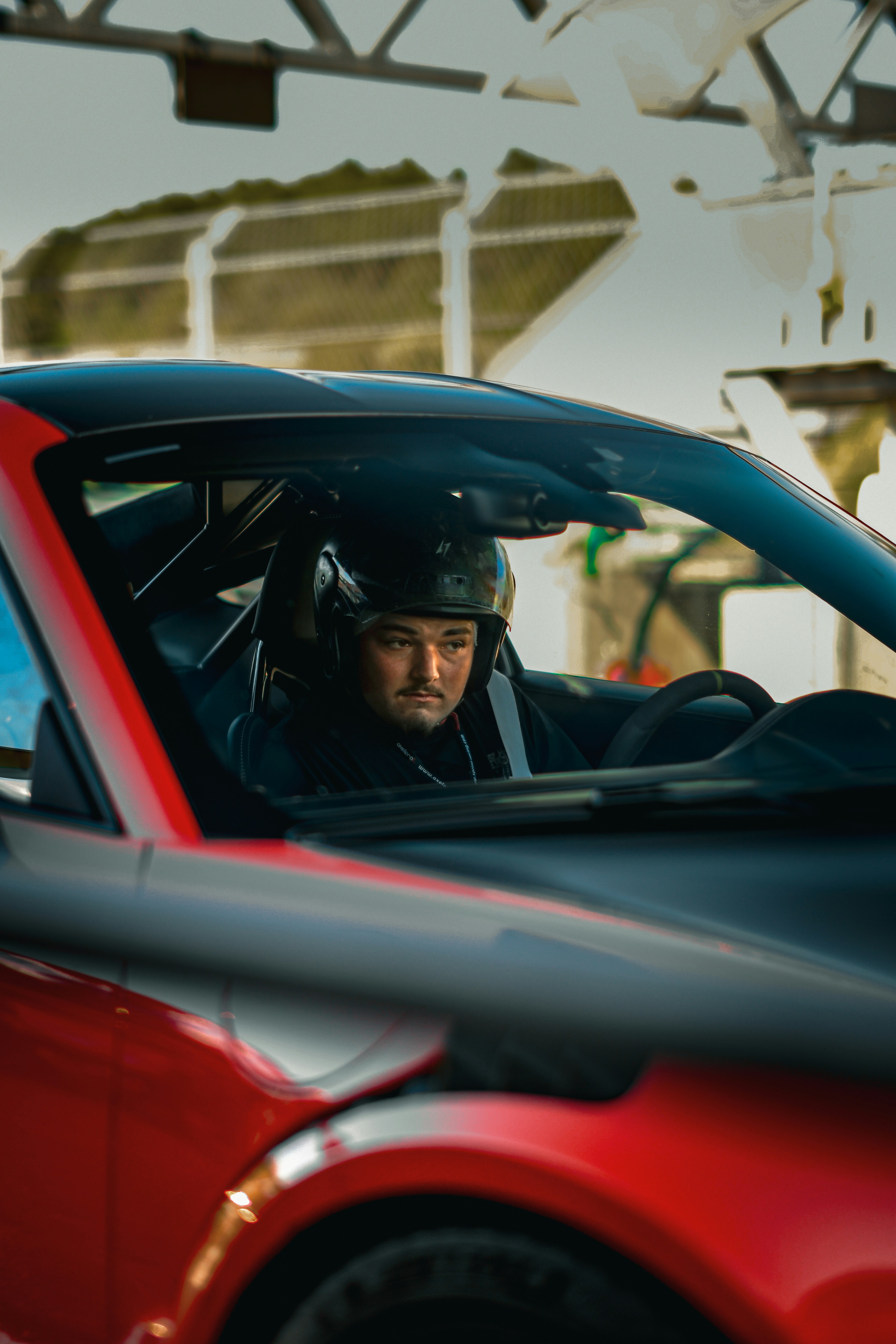 Driver in Focus: A Racing Helmeted Moment Behind the Wheel