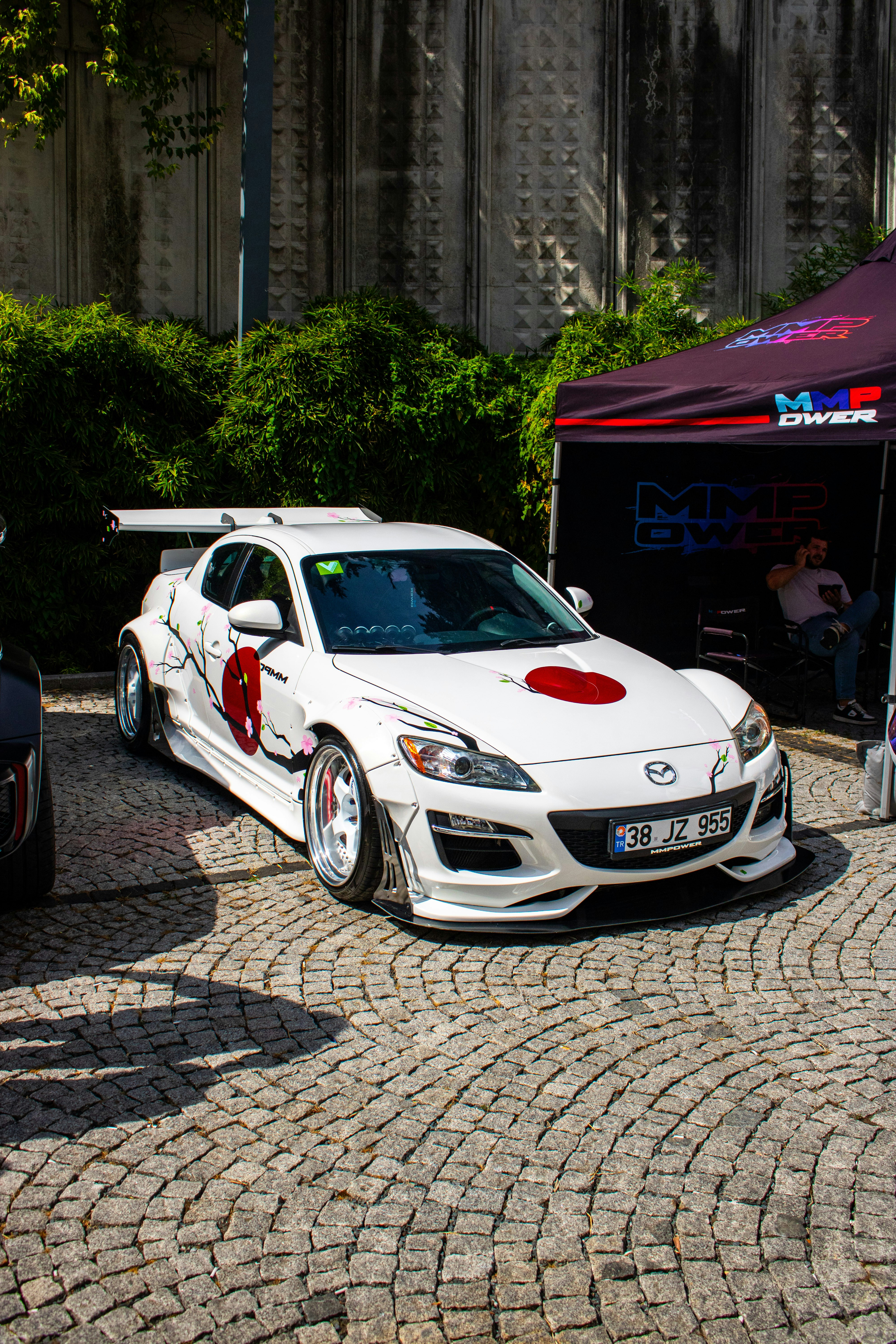 Low-Profile Mazda Rally Car on Cobblestone Stage