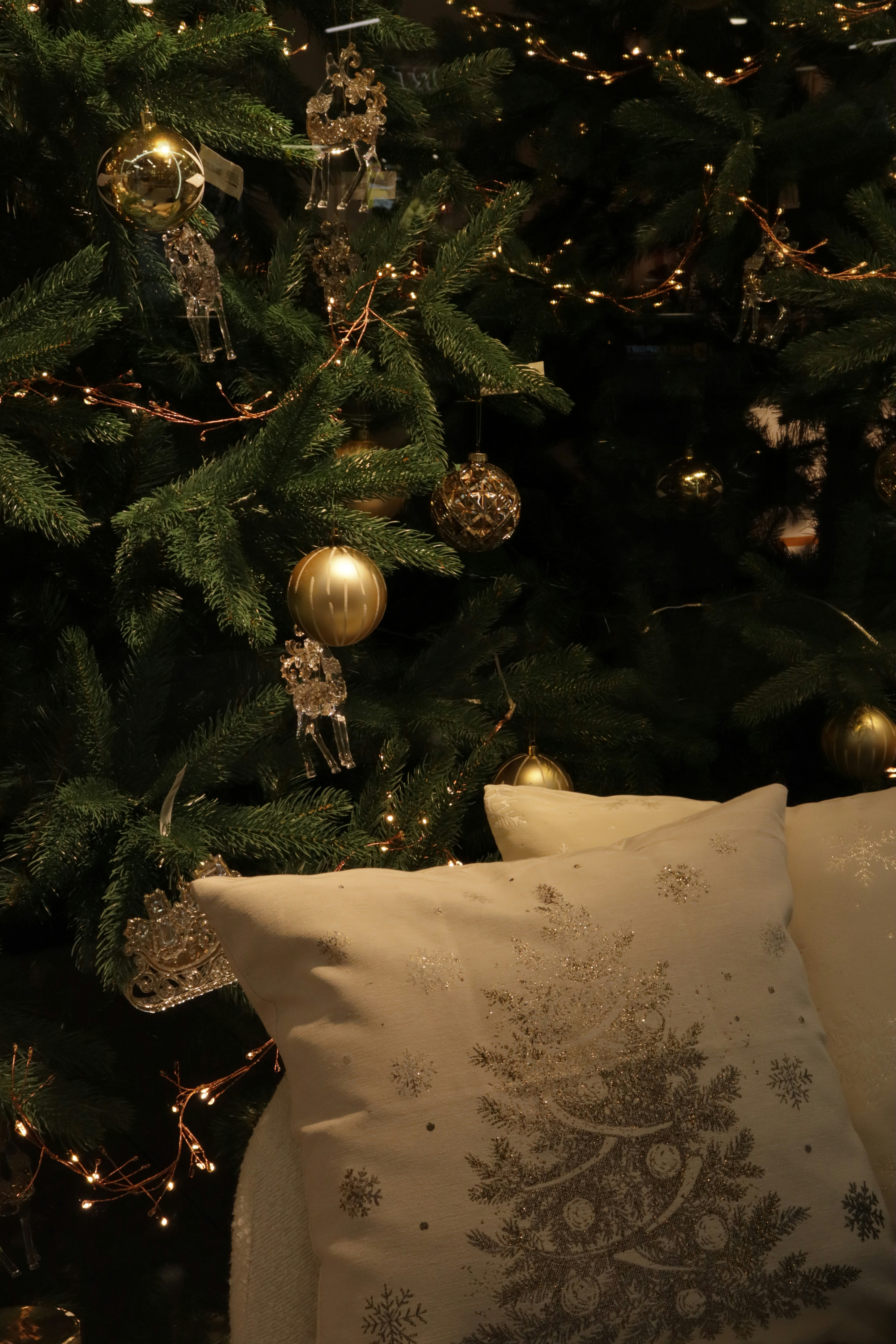 Golden Ornaments Glow Among Snowflake Cushions
