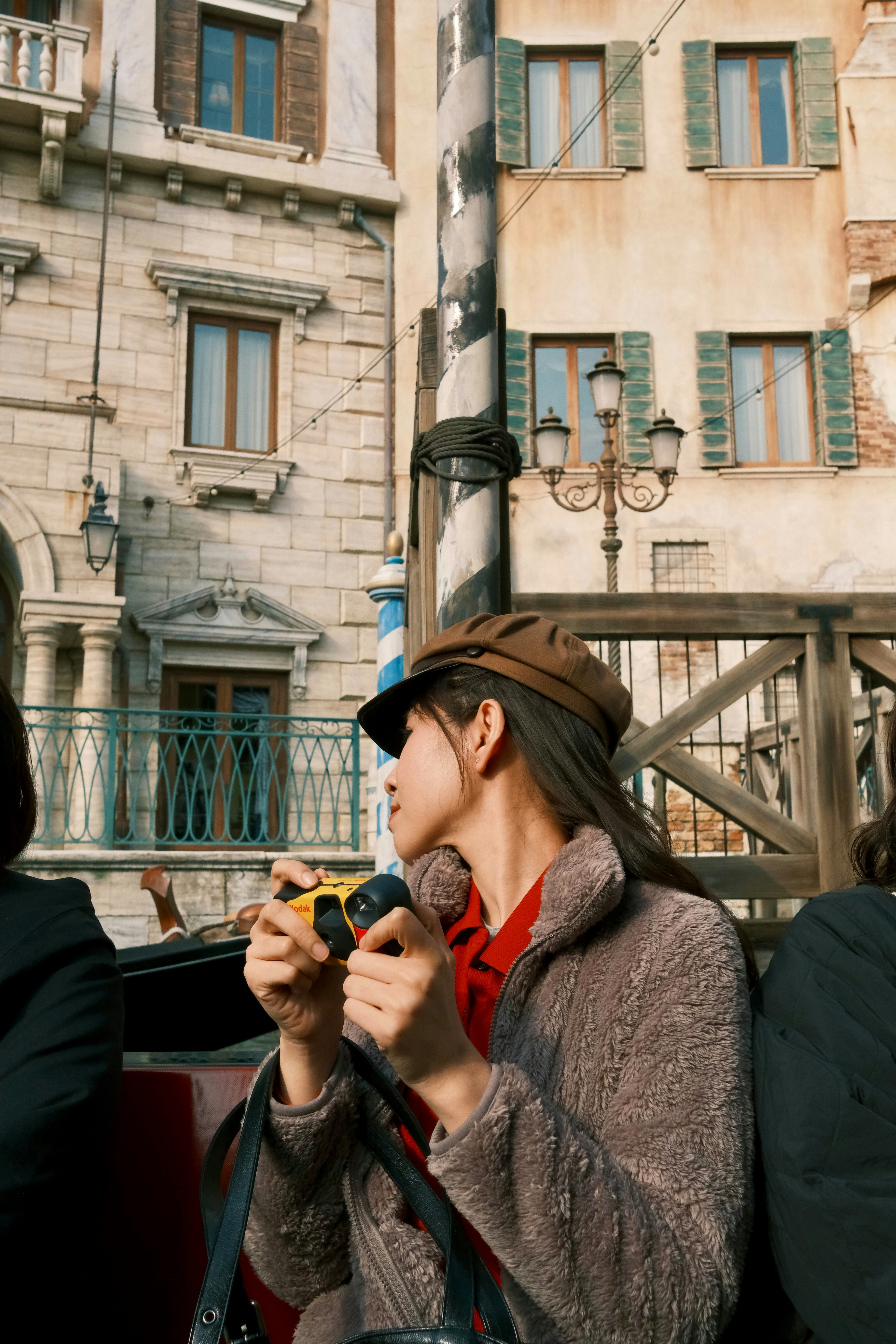 Traveler with Camera in a Spanish-style Street Scene