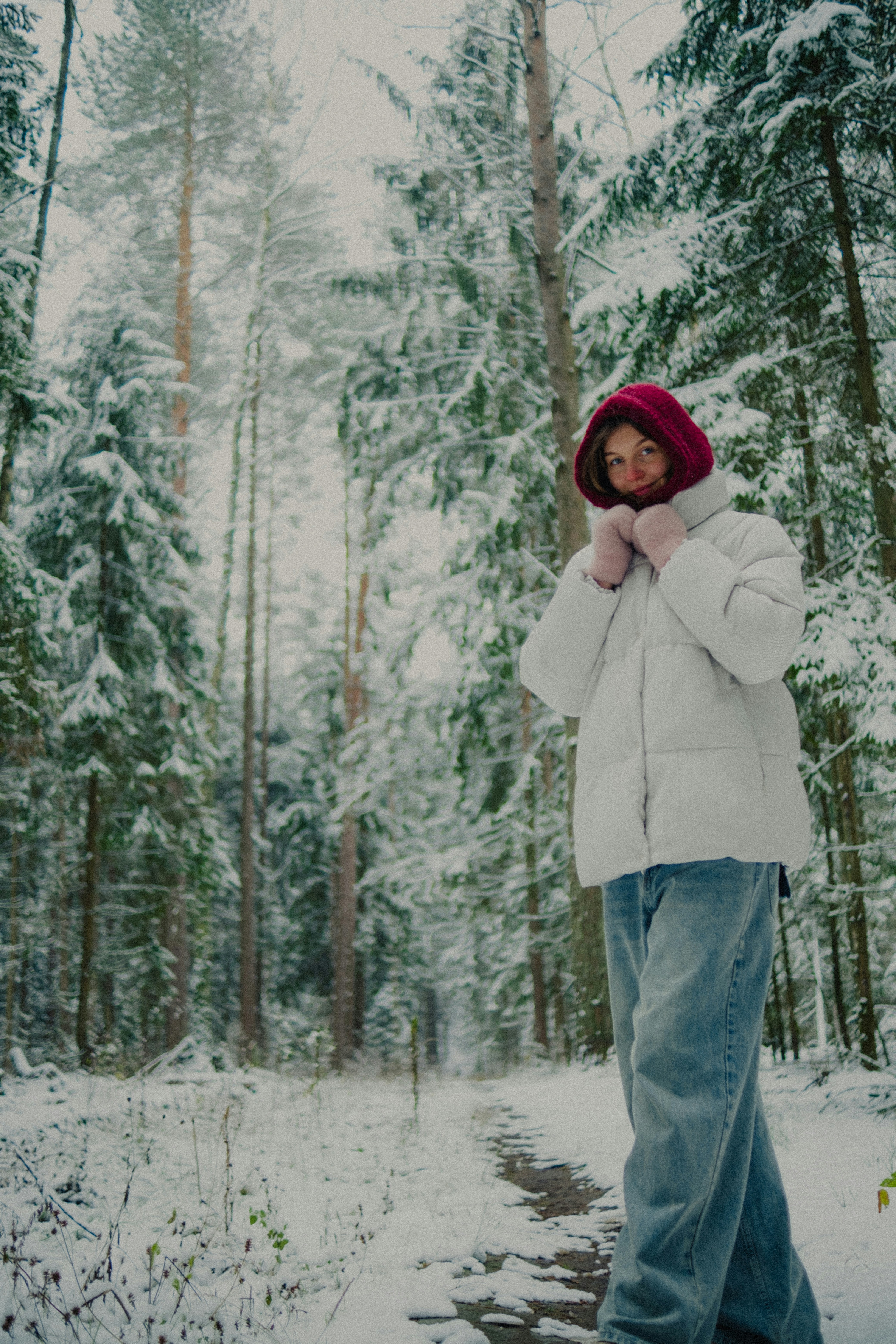 Winter Whisper: A Woman in a Snowy Forest Ready for Warmth
