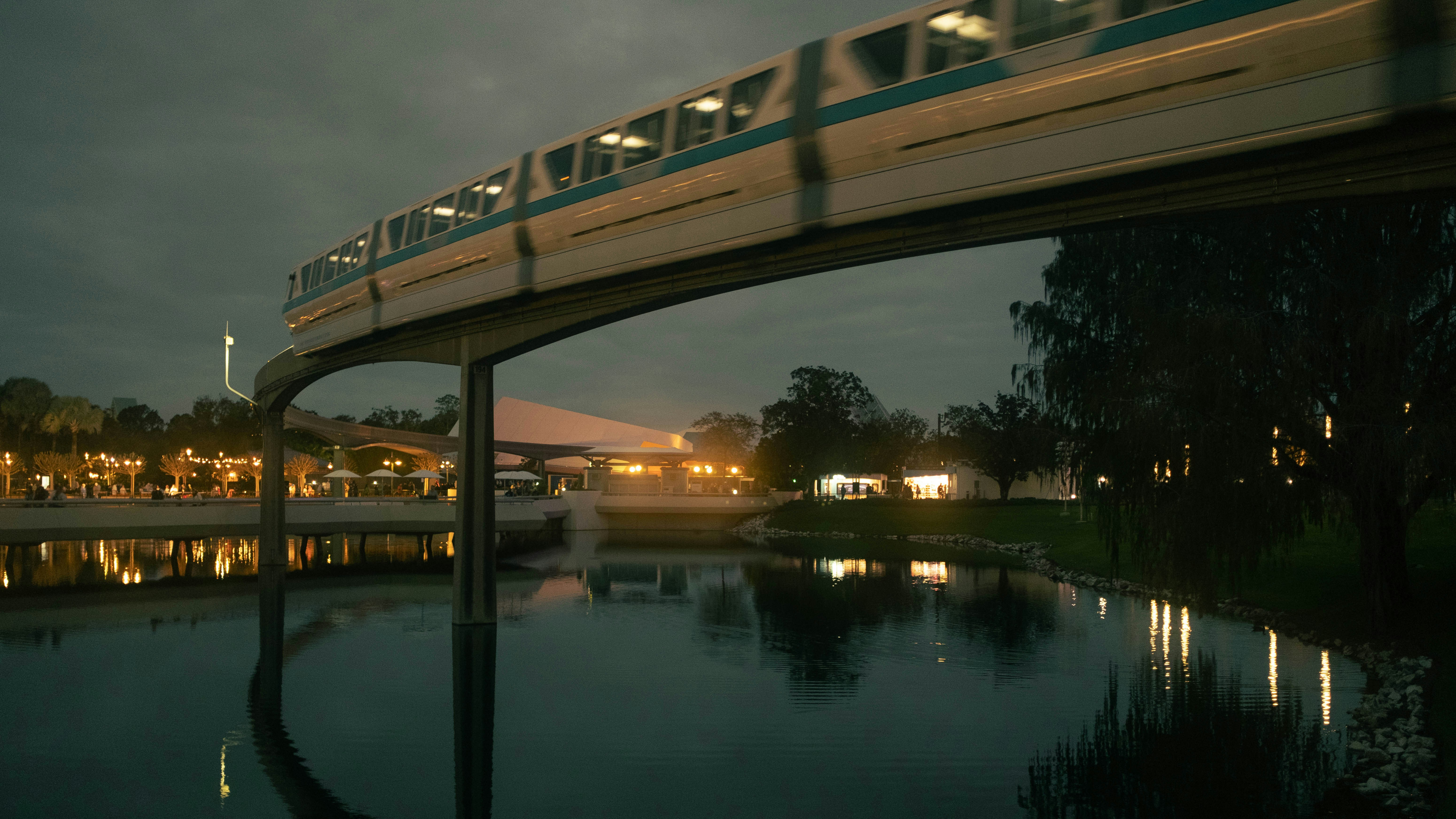 Night Train over Quiet Waters: A Riverside Bridge in Motion
