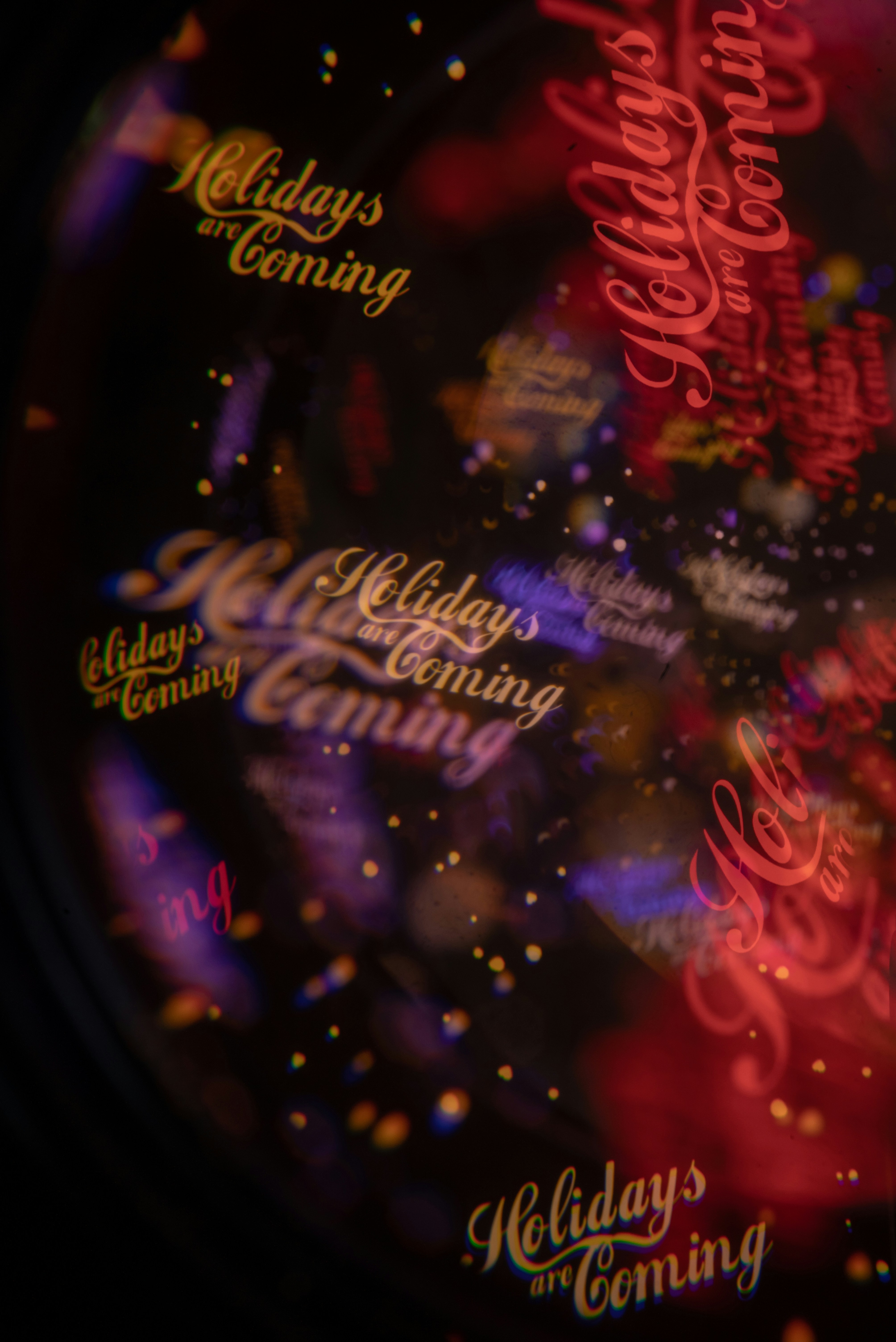 Bokeh Holiday: Neon Script Fragments Through a Glassy Lens