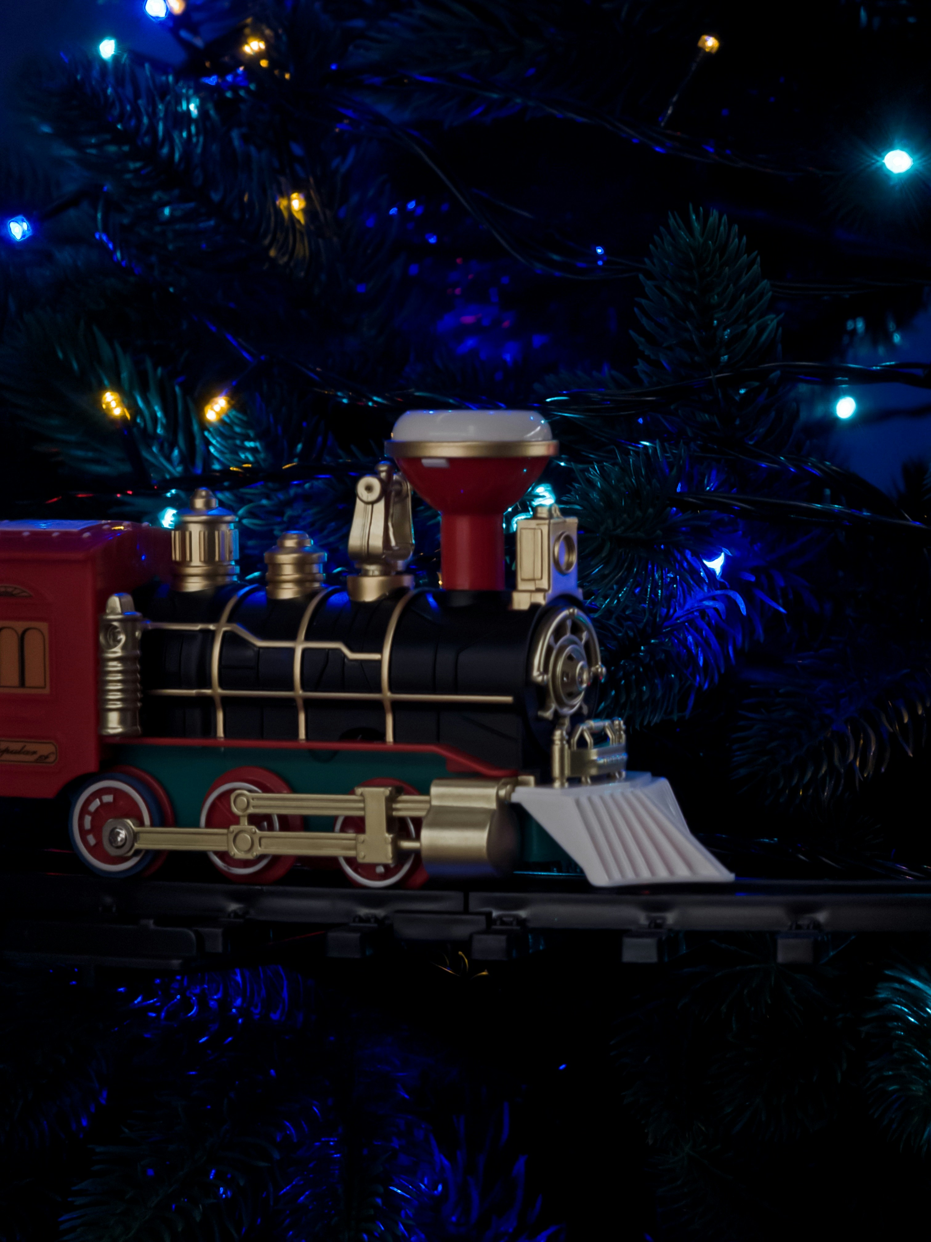 Toy Steam Engine in a Moonlit Christmas Glow