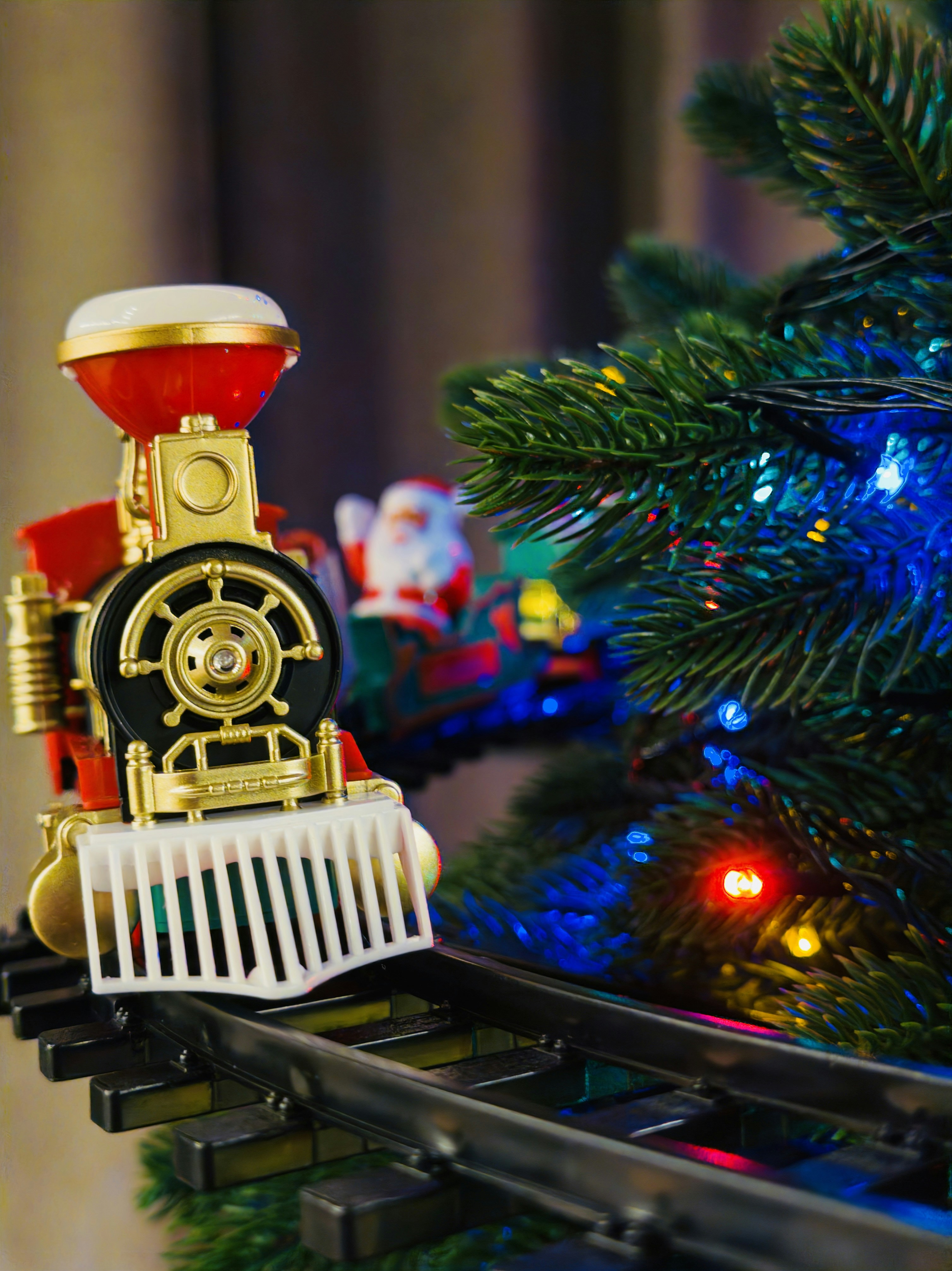 Toy Steam Engine Chugging Through Holiday Lights