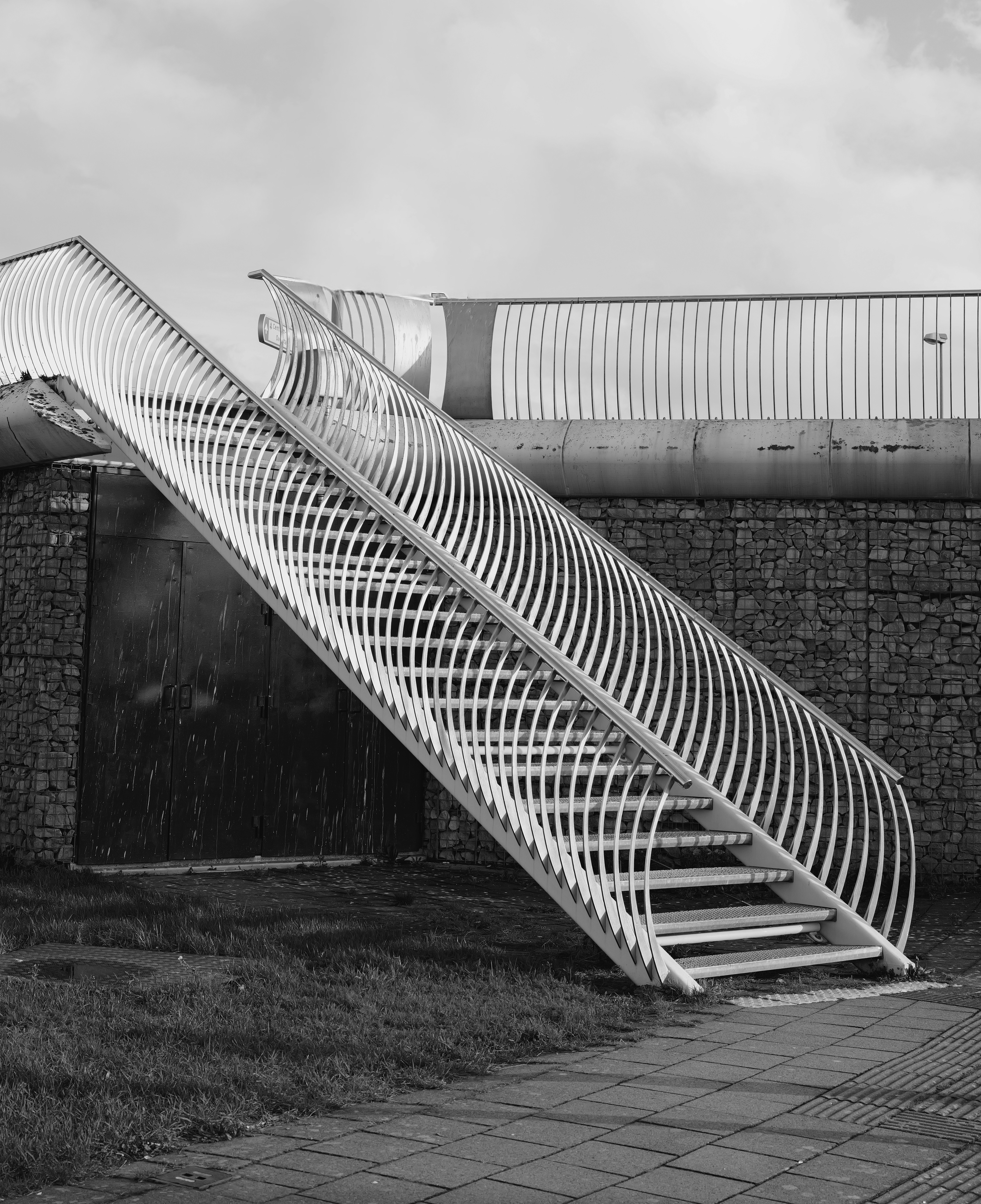 Industrial Staircase in Abstract Arching Rails