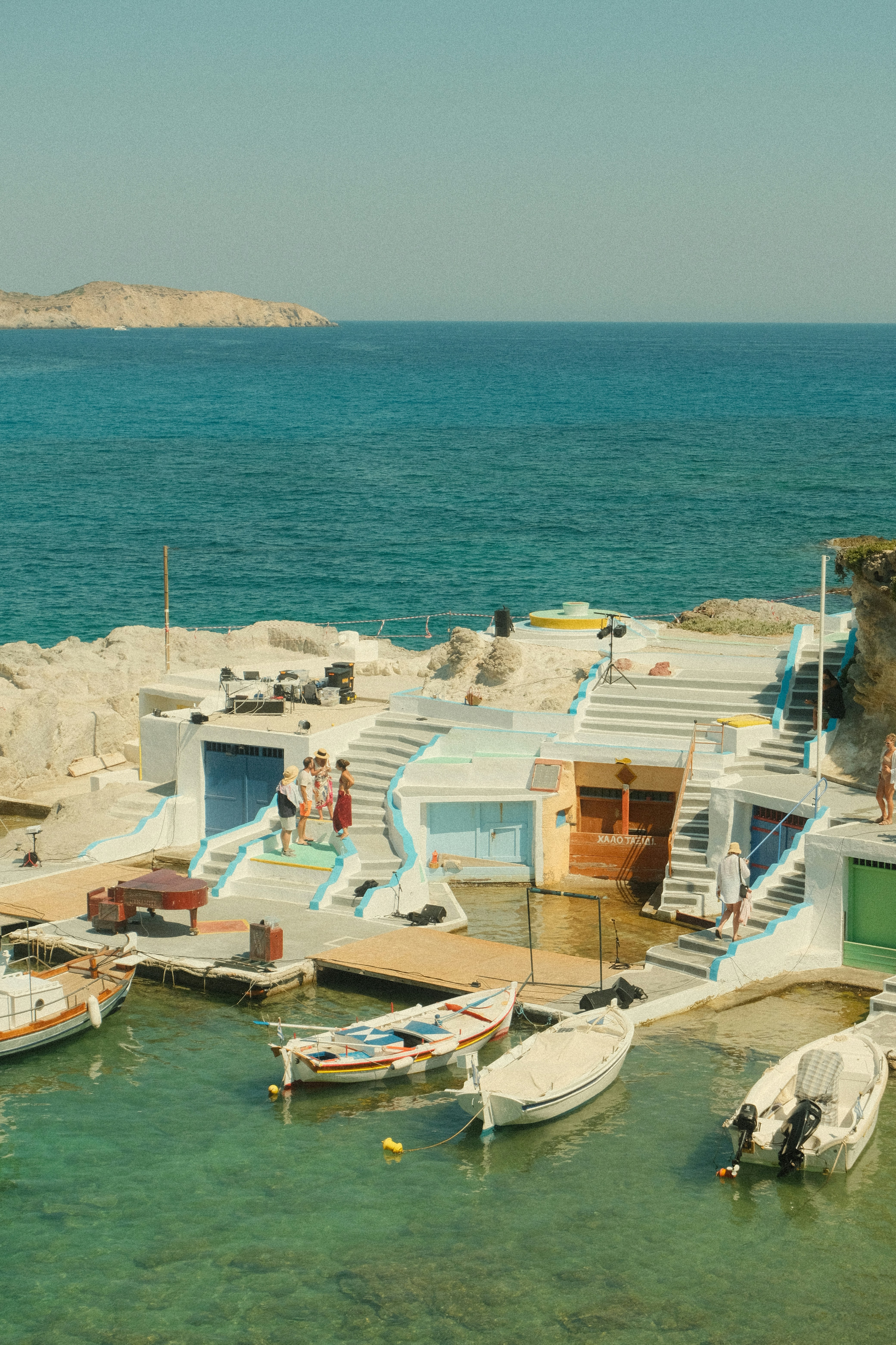 Terraced coastal pool village at golden hour