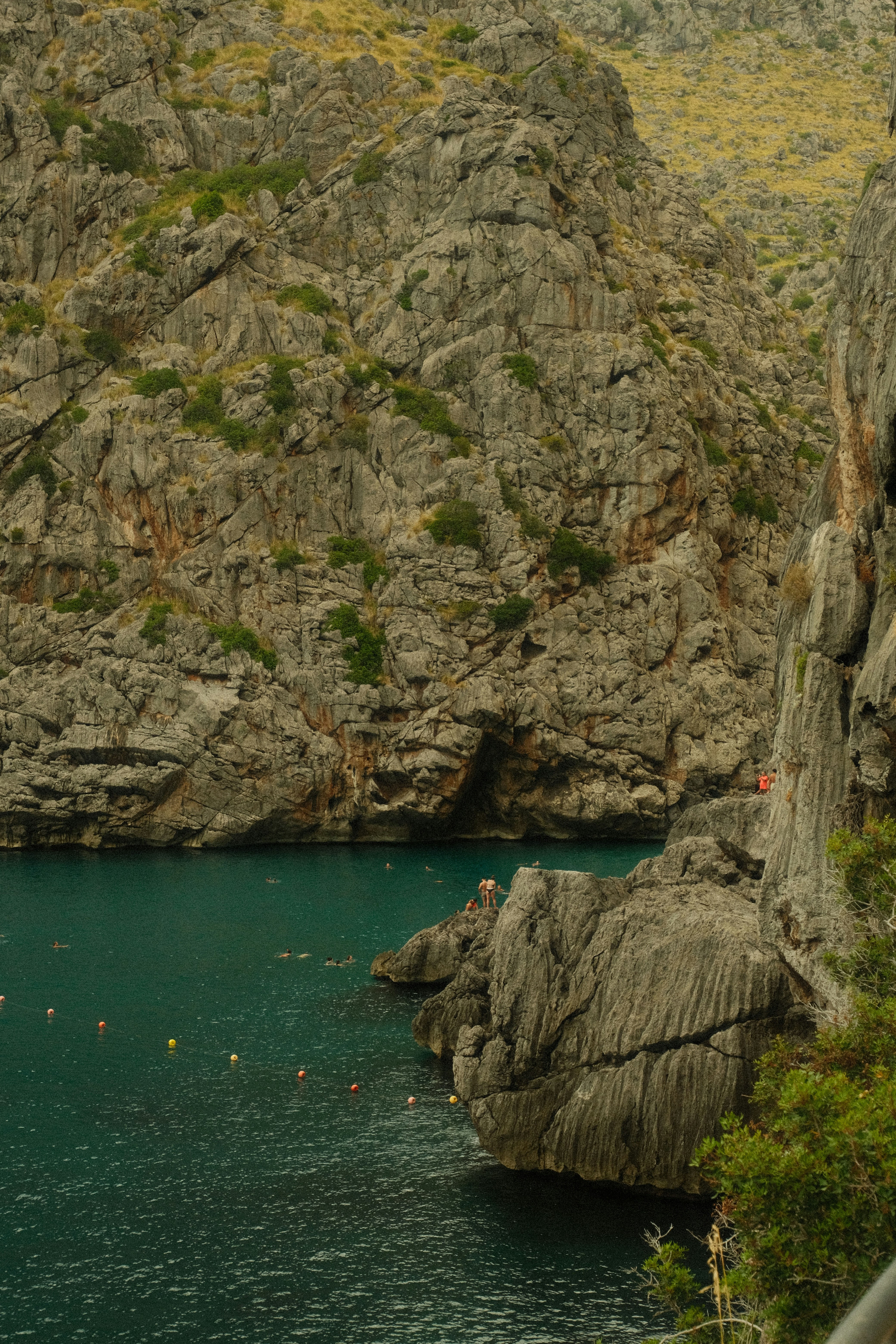 Teal Sea Among Stony Giants: Coastal Caves at Dusk