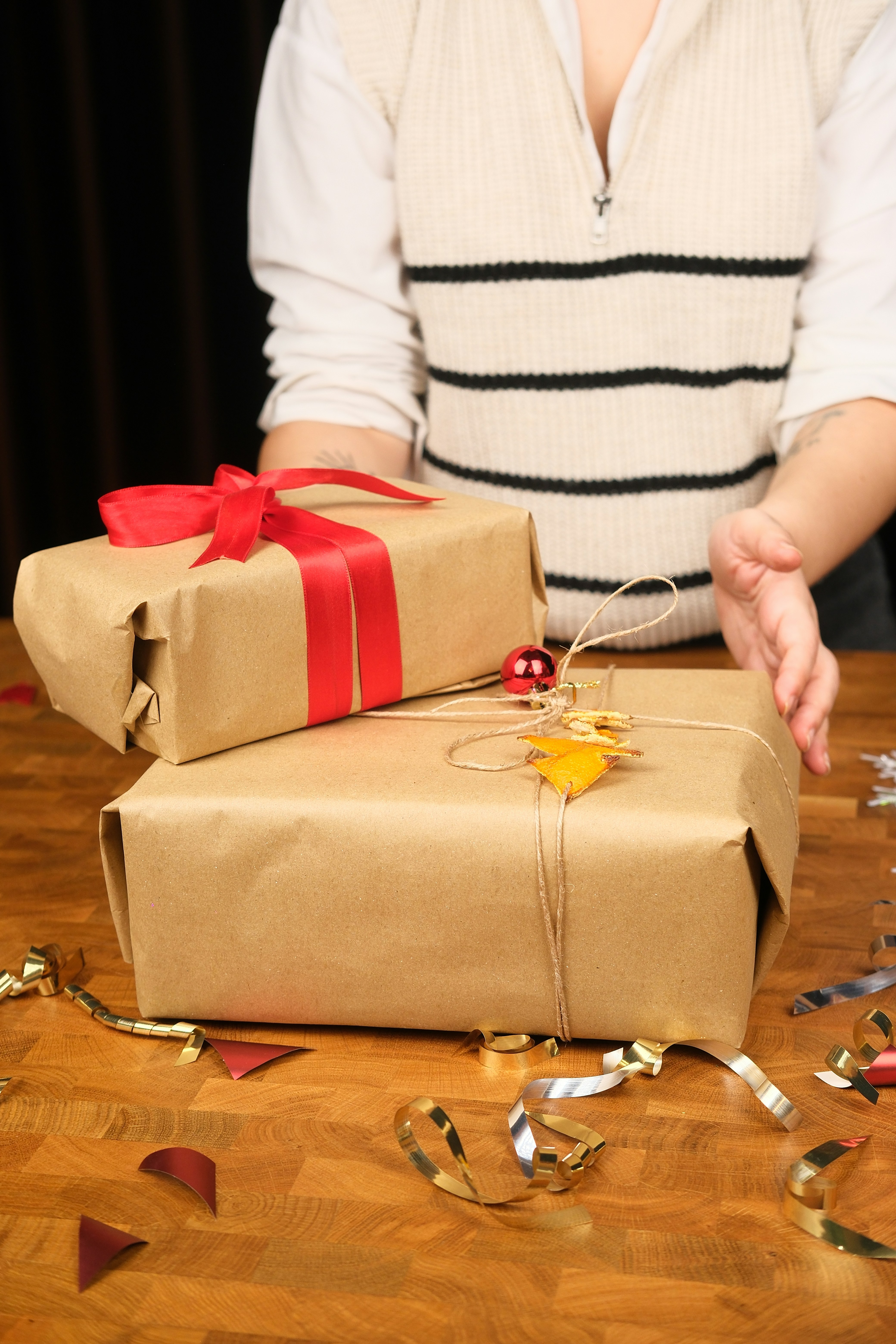 Two wrapped gifts with red ribbon and confetti. photo – Free Winter ...