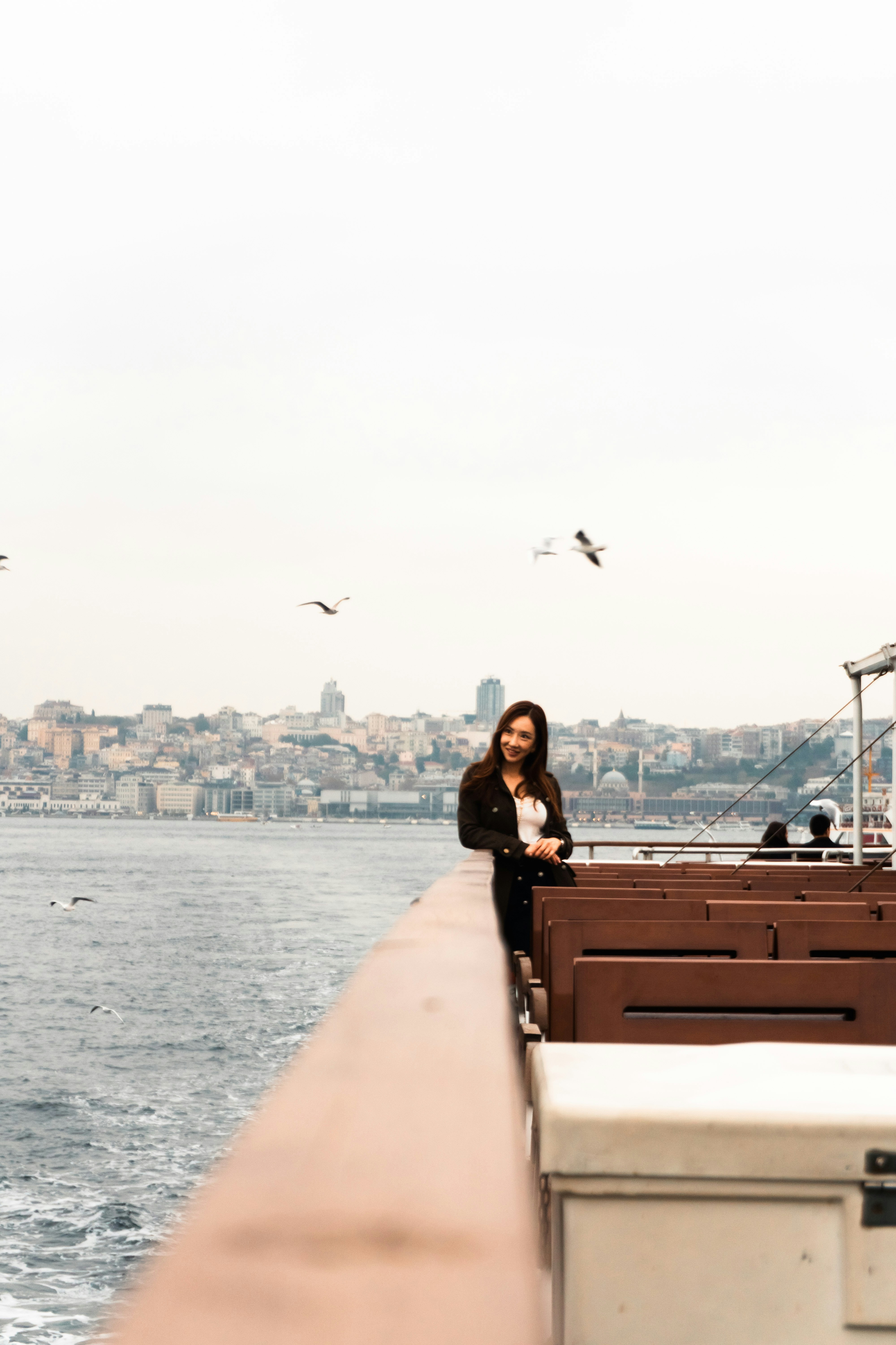Edge of the Waterfront: Cityscape and Passenger Deck Portrait