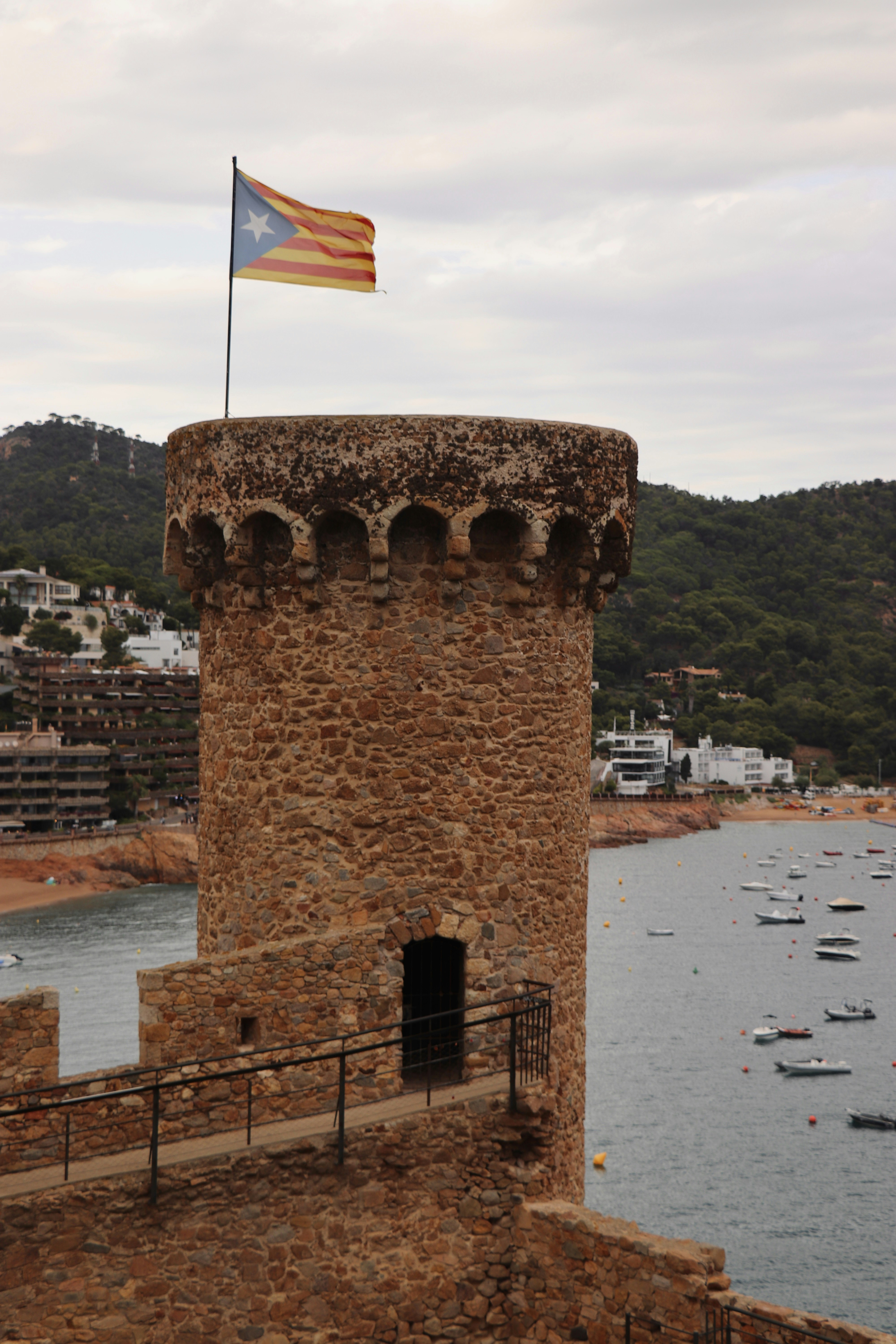 Flag over the Circular Tower: sunset harbor scene