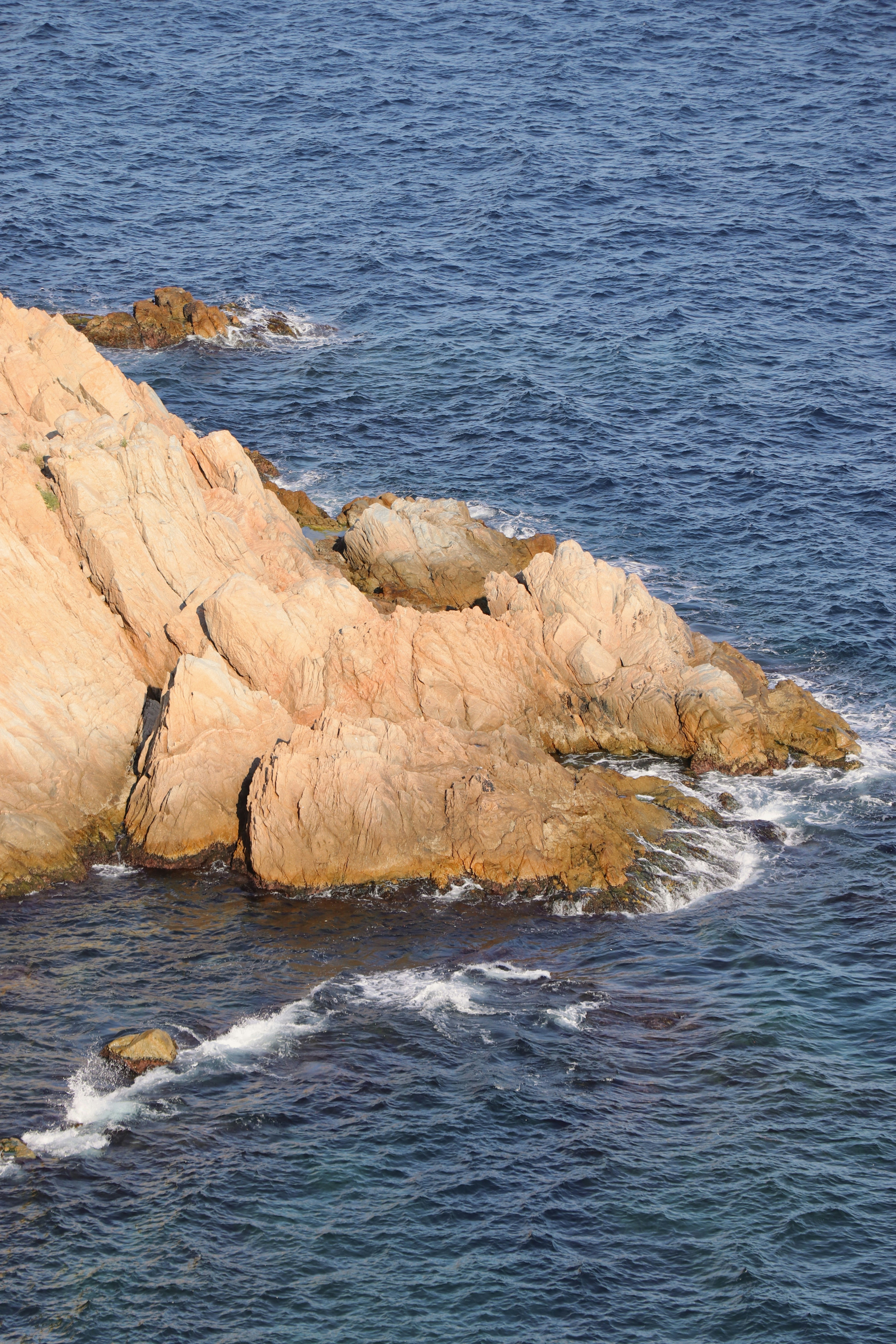 Sunlit Cretan Cliffs Cradling the Sea