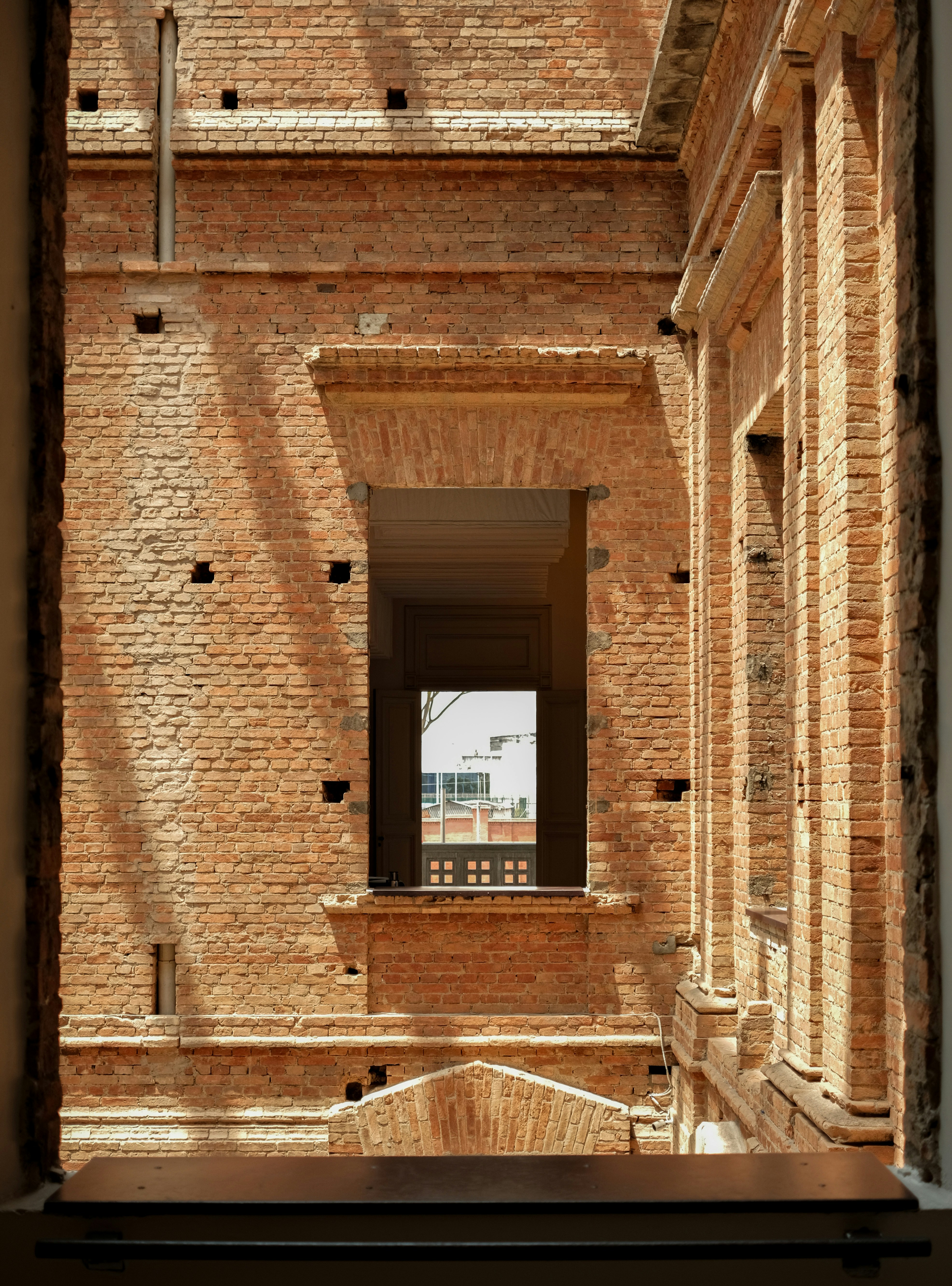 Light through a Brick Corridor: a Framed Window to the City