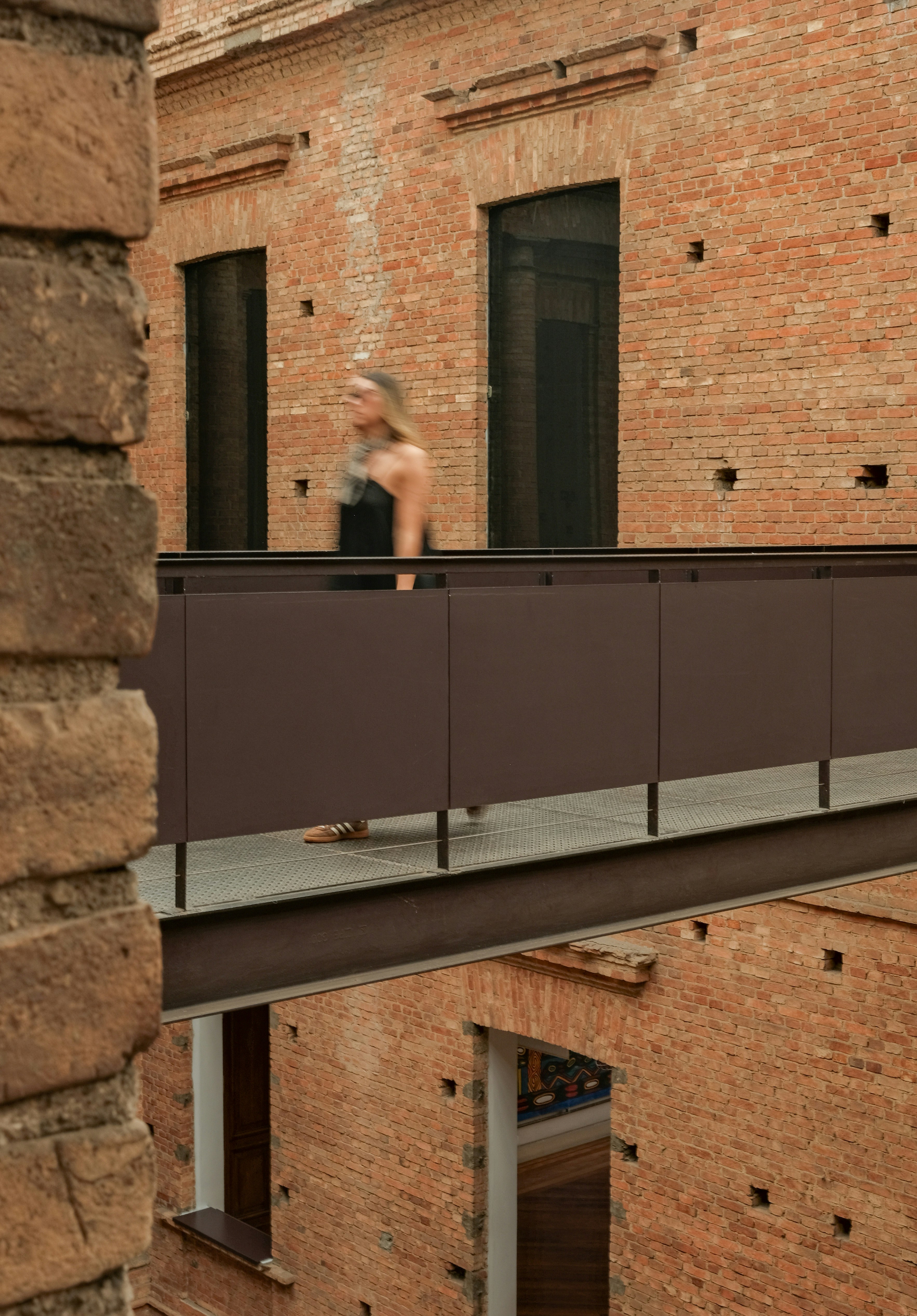 Blurry Passage: A Walk Across a Rust Brick Corridor