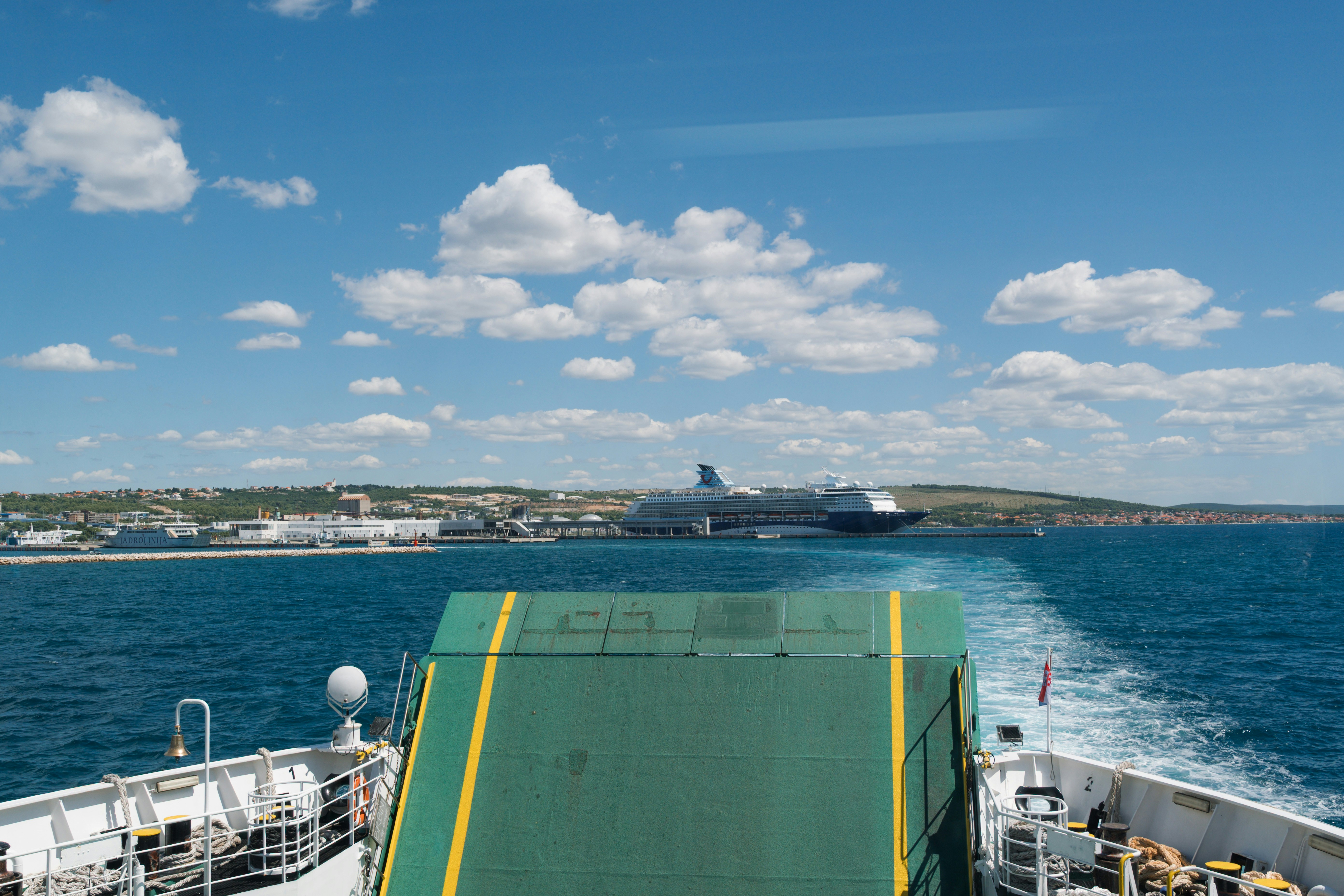 Bow Forward: A Ferry’s Green Ramp Reaches the Open Sea