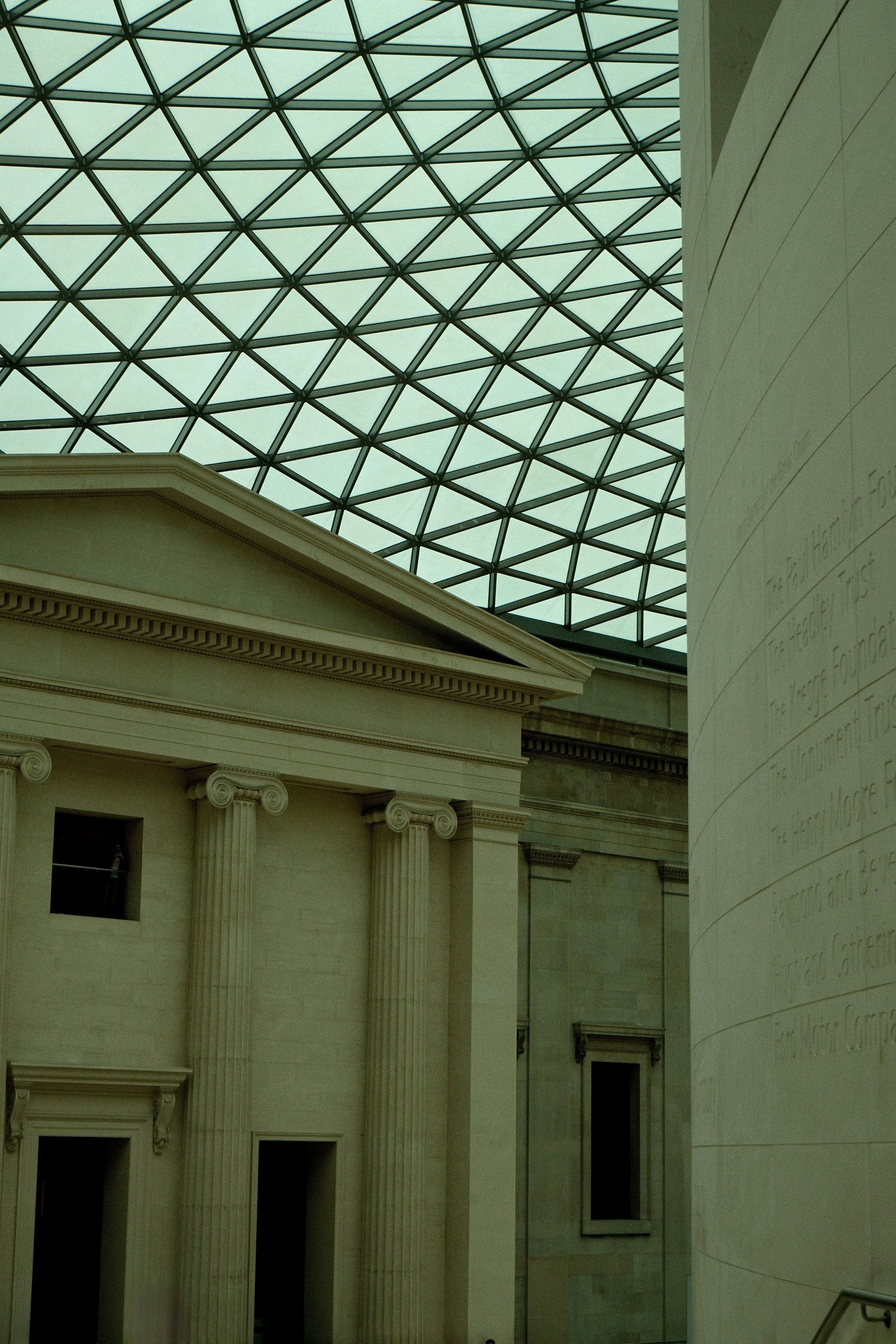 Geometric Cathedral: A Glass Roof Over Classical Facades