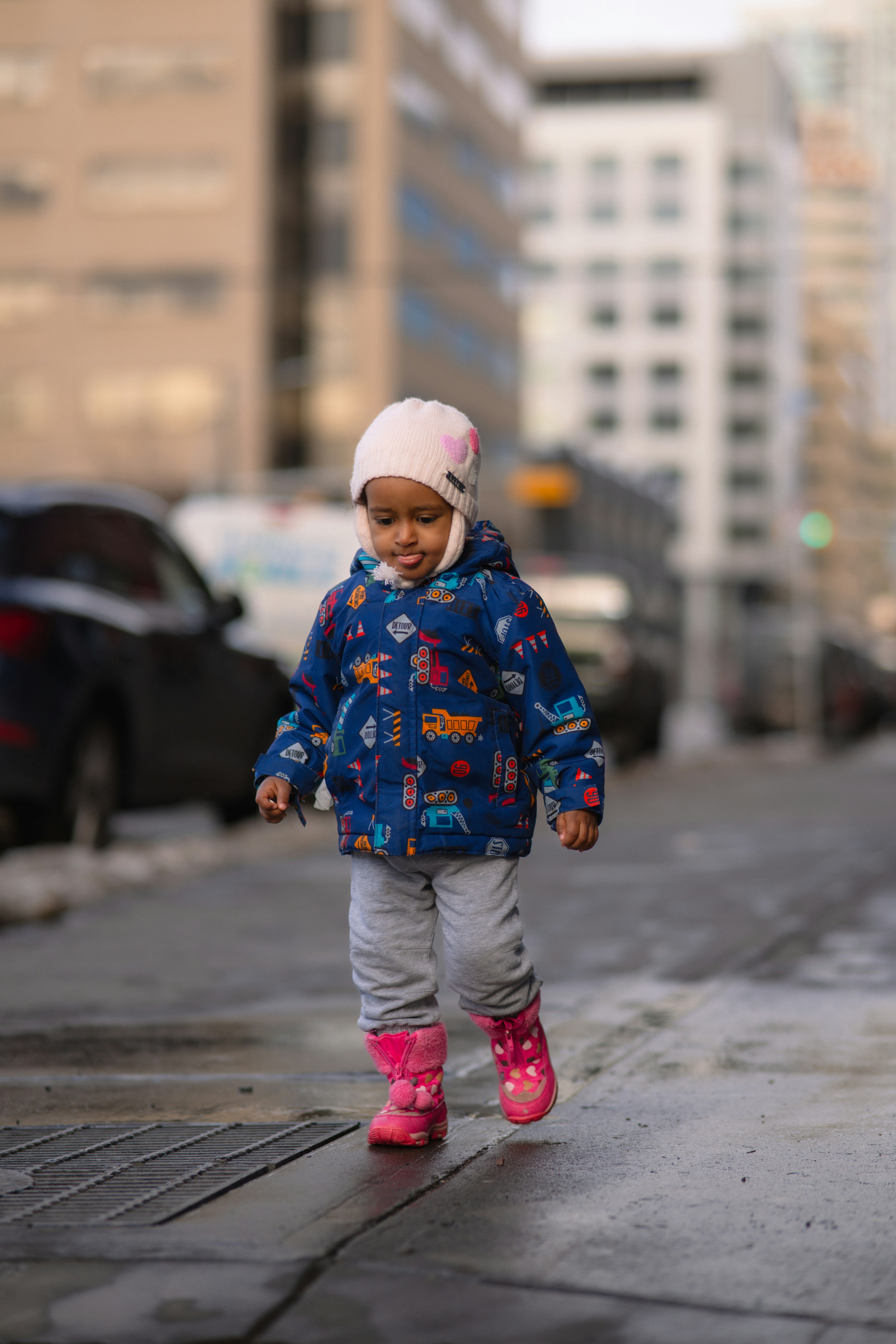 Young child walking on a city street in winter photo – Free Winter ...