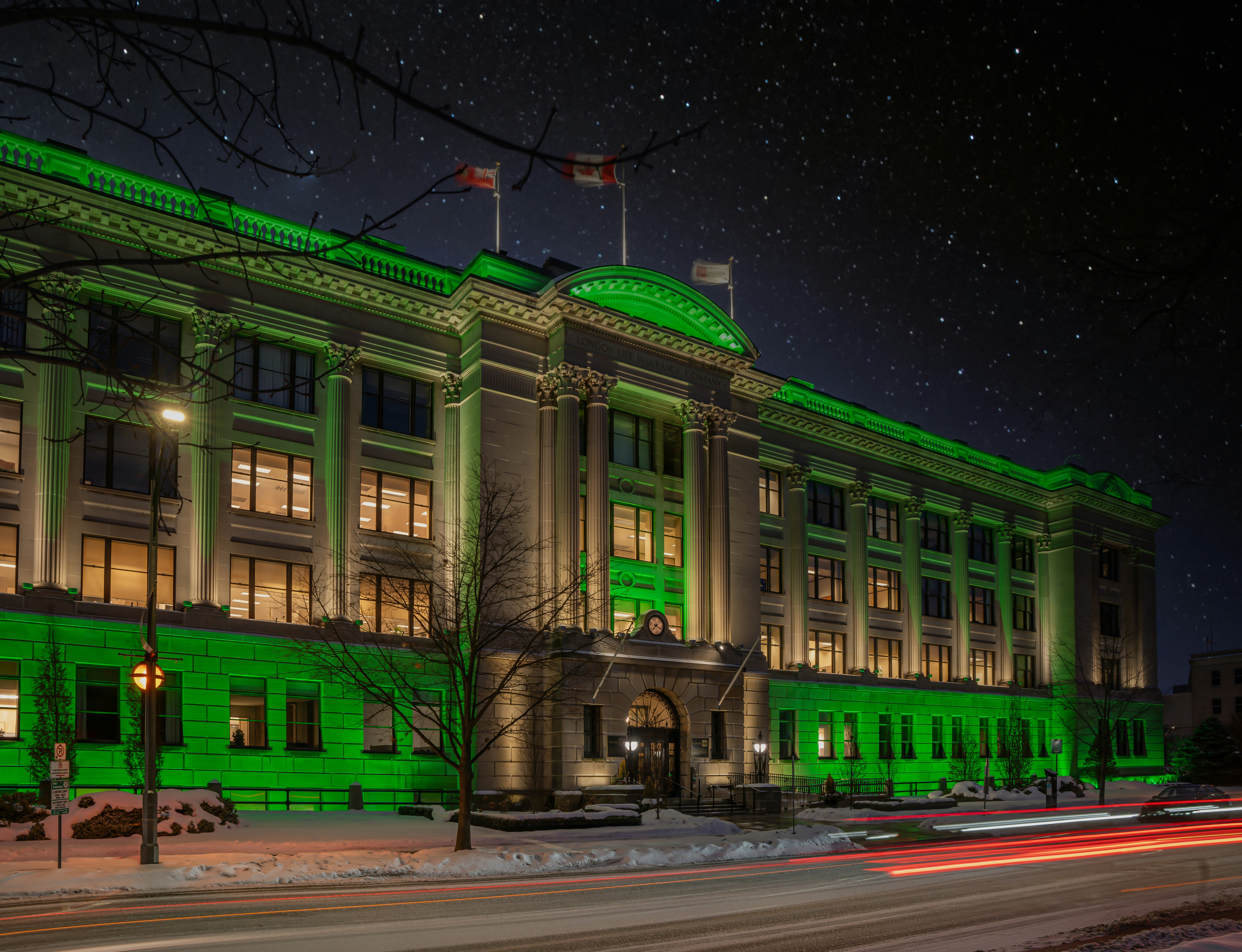 Night Green: A Historic Facade Bathed in Emerald Light