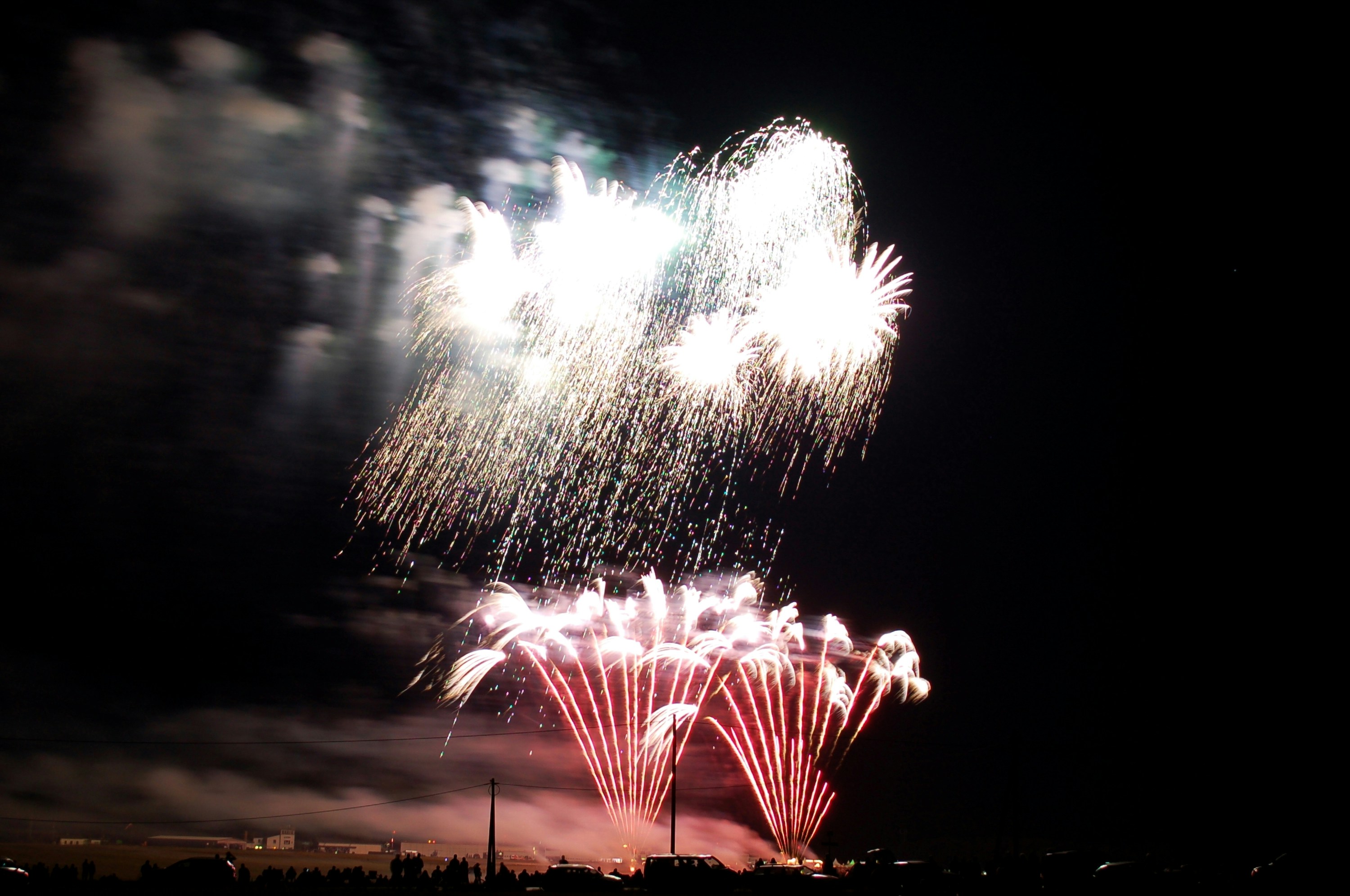 Night Sky Bursts: Fireworks Over a Quiet Horizon