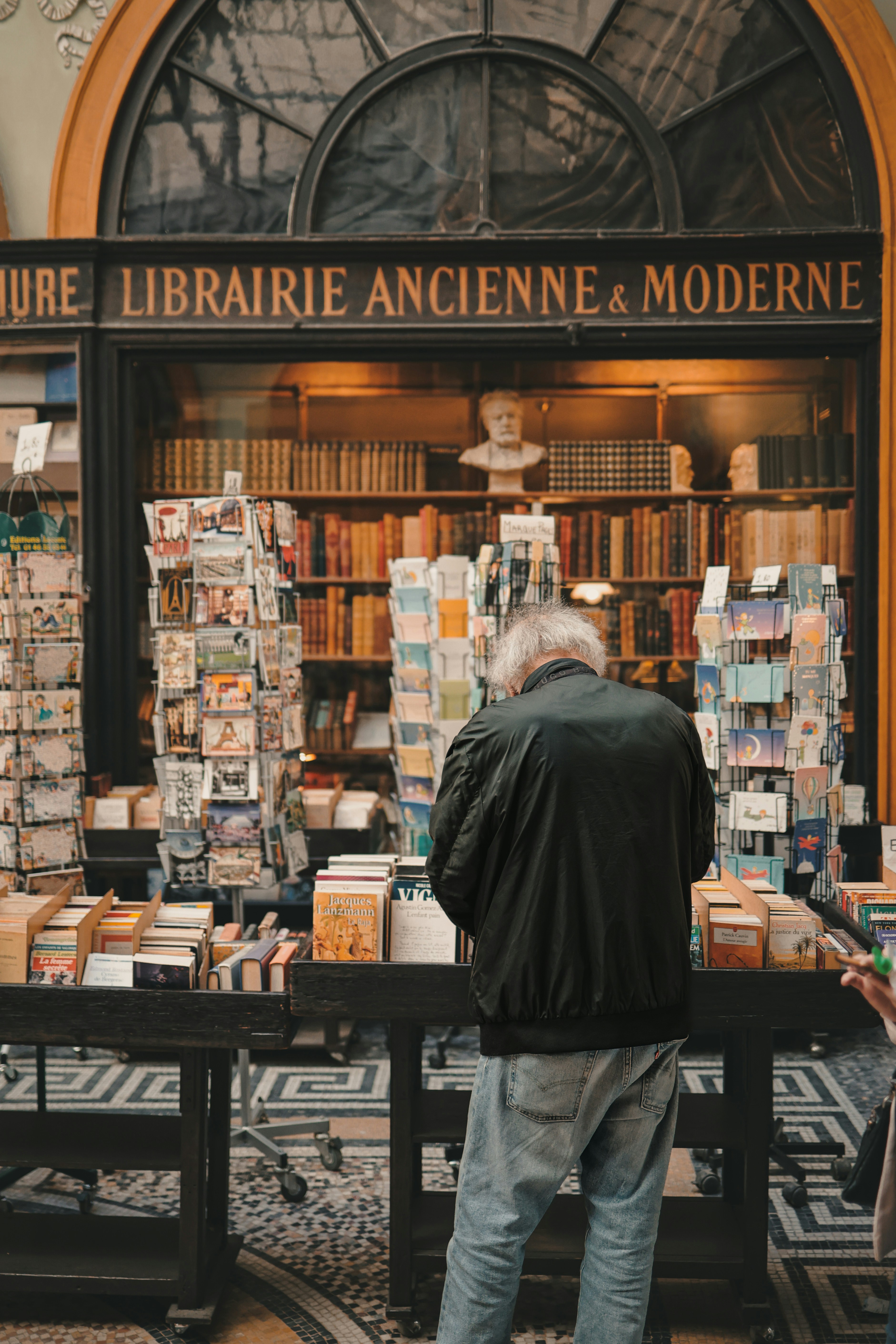 Between Shelves: A Reader Deep in a Parisian Bookstore Moment