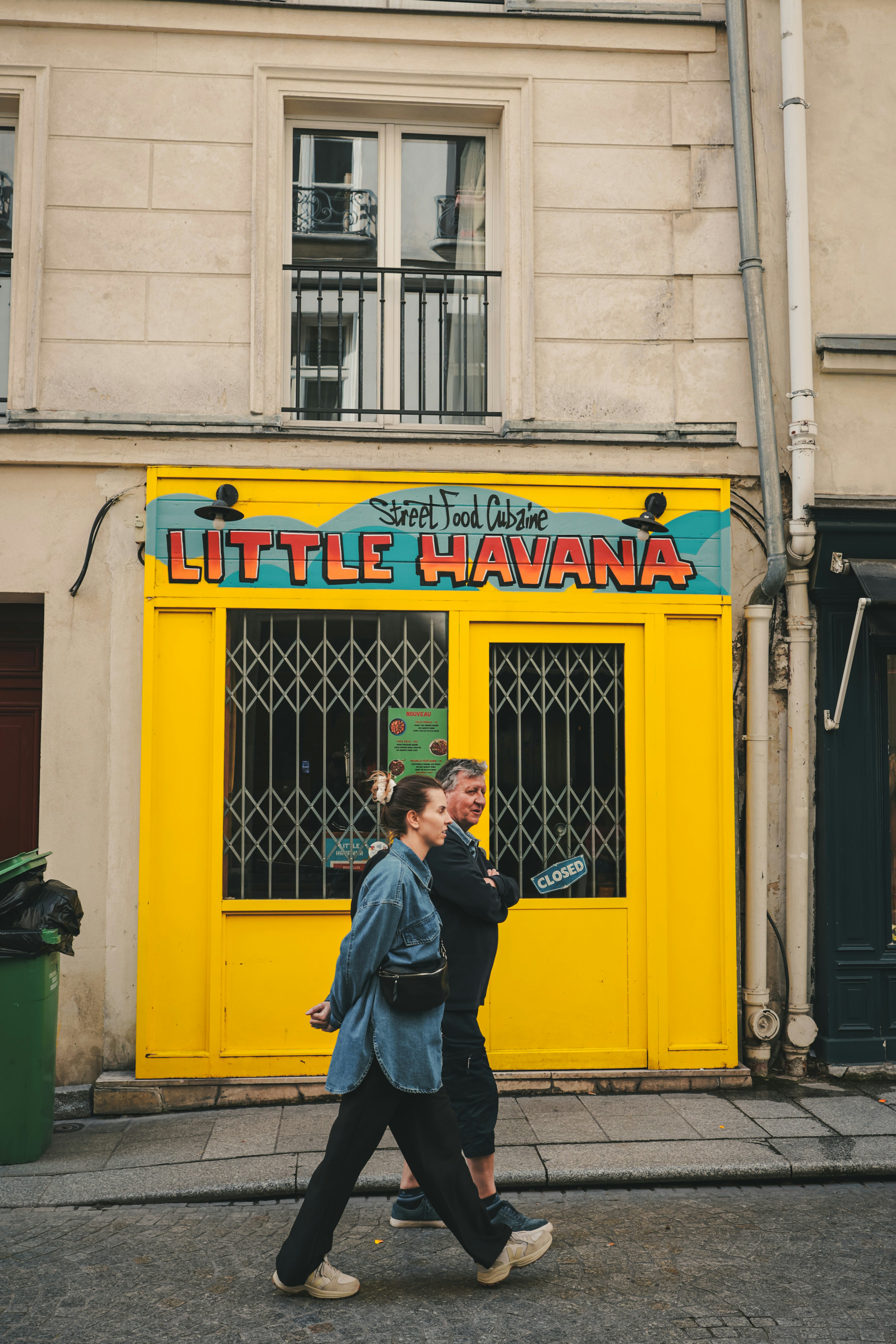 Yellow Doorway, Two Walkers: Urban Narrative at Little Havana