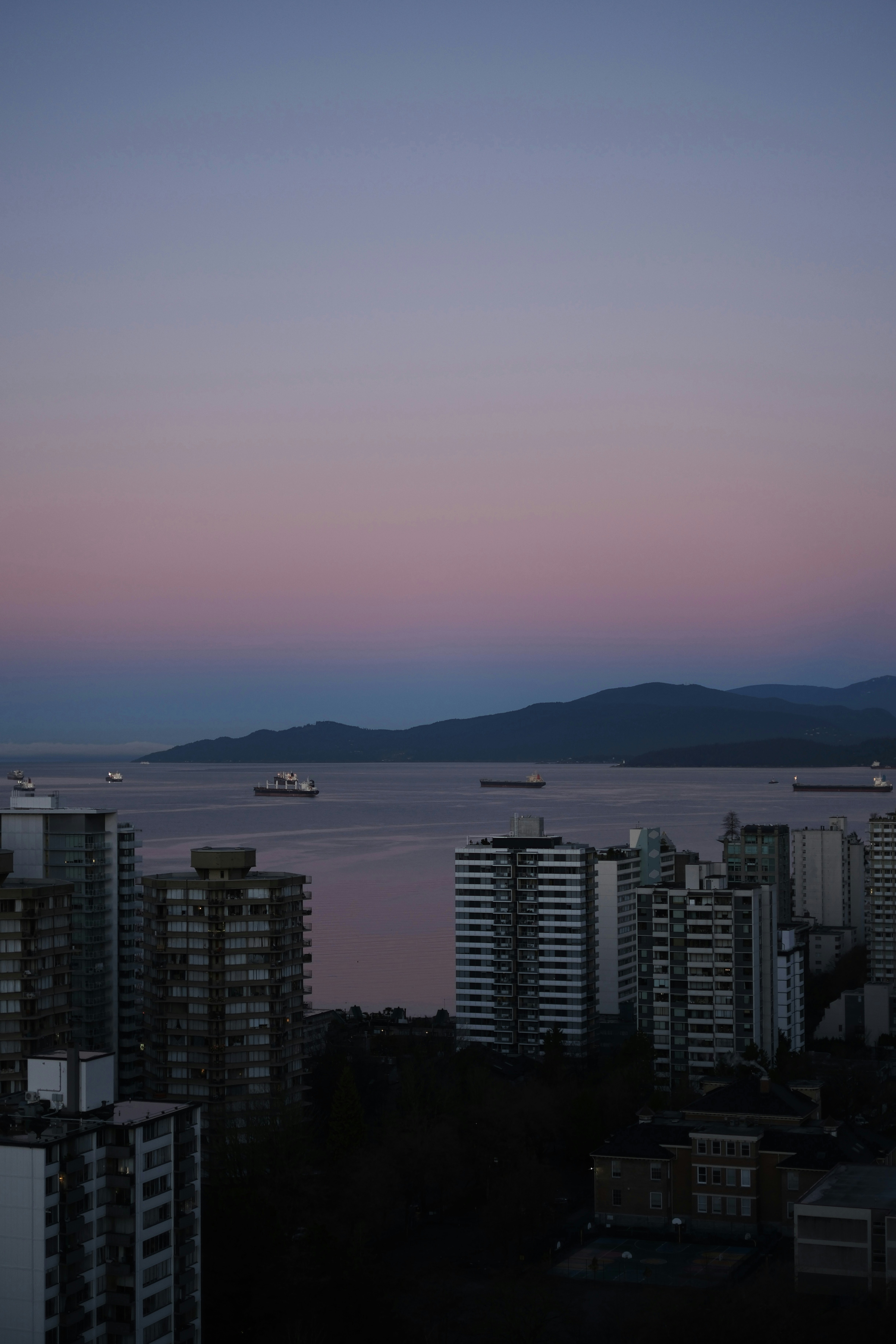 Dusk Over the Harbor: City Silhouettes Against a Velvet Sky