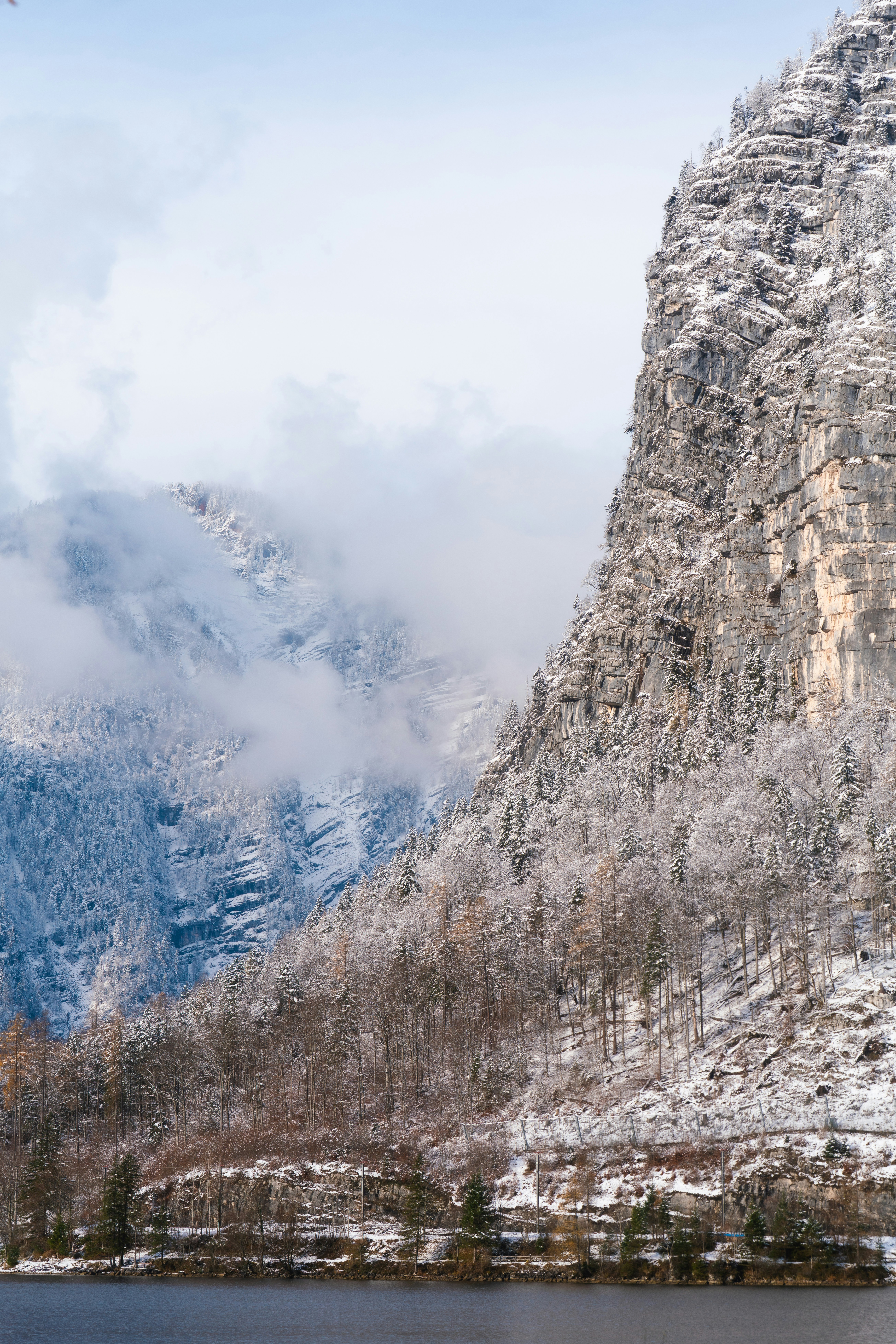 Sunlight Over Snowy Cliffside