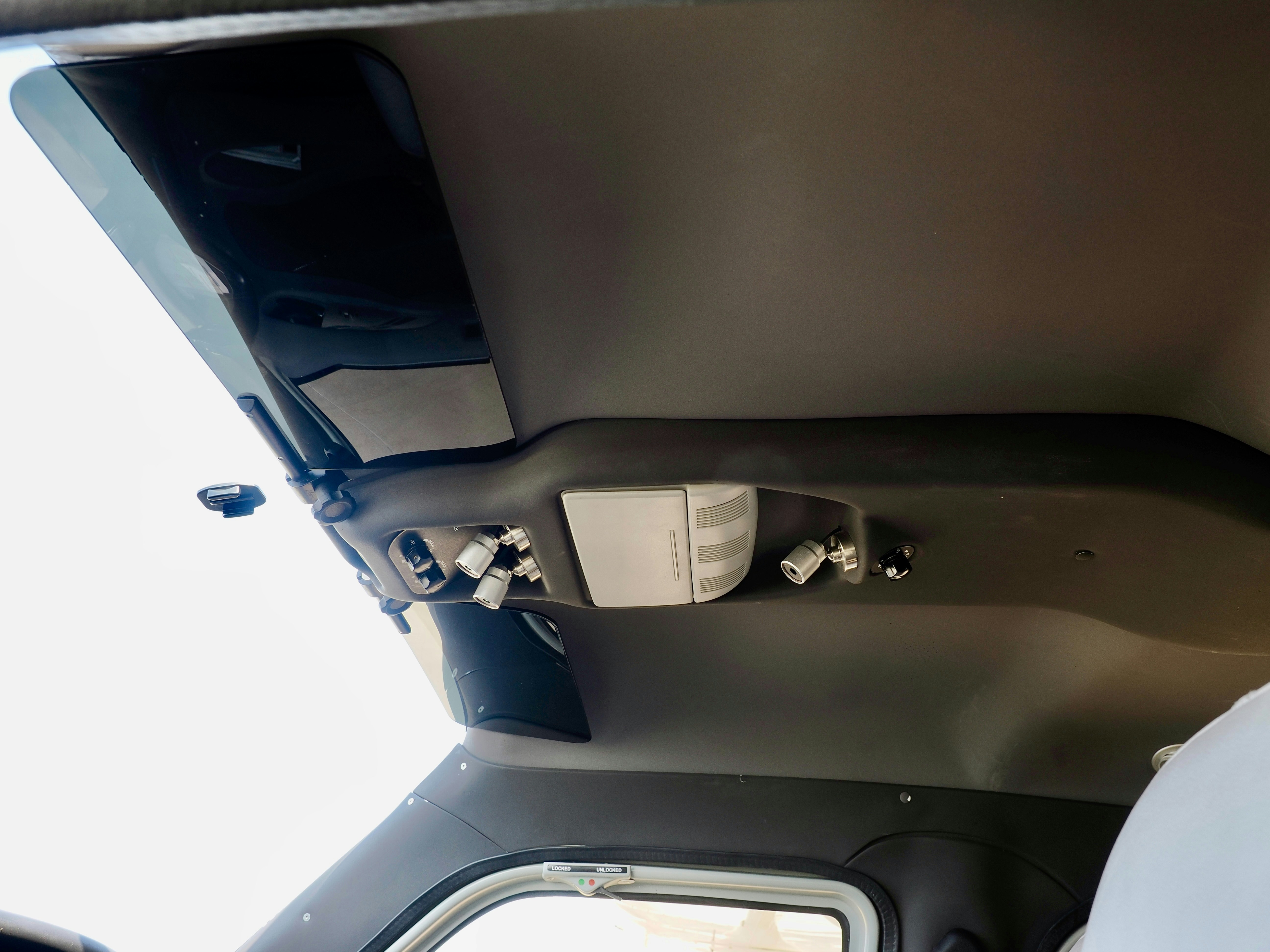 Interior view of a small aircraft cockpit ceiling