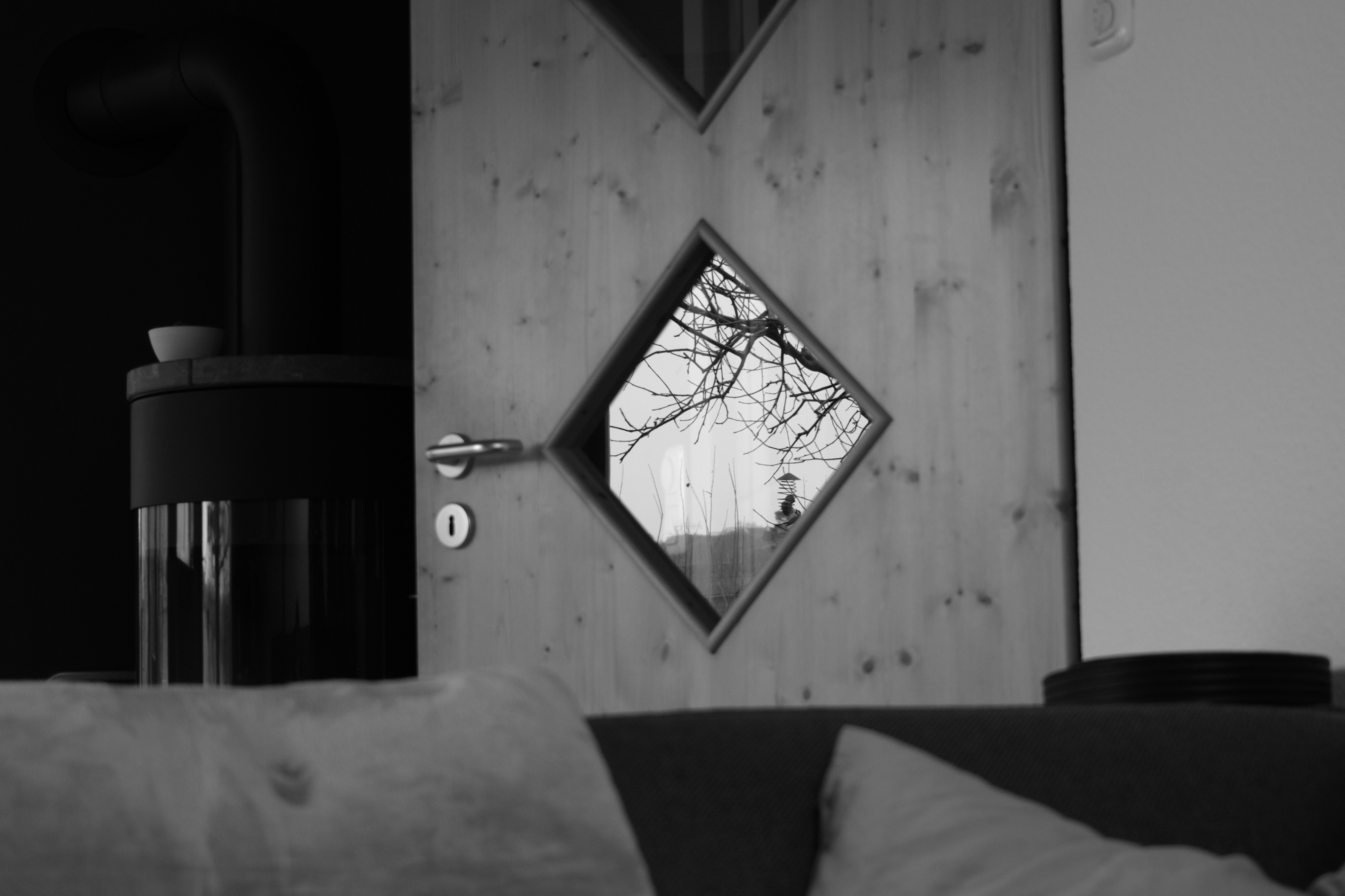 Diamond Window and Doorway: Quiet Geometry in a Monochrome Living Room