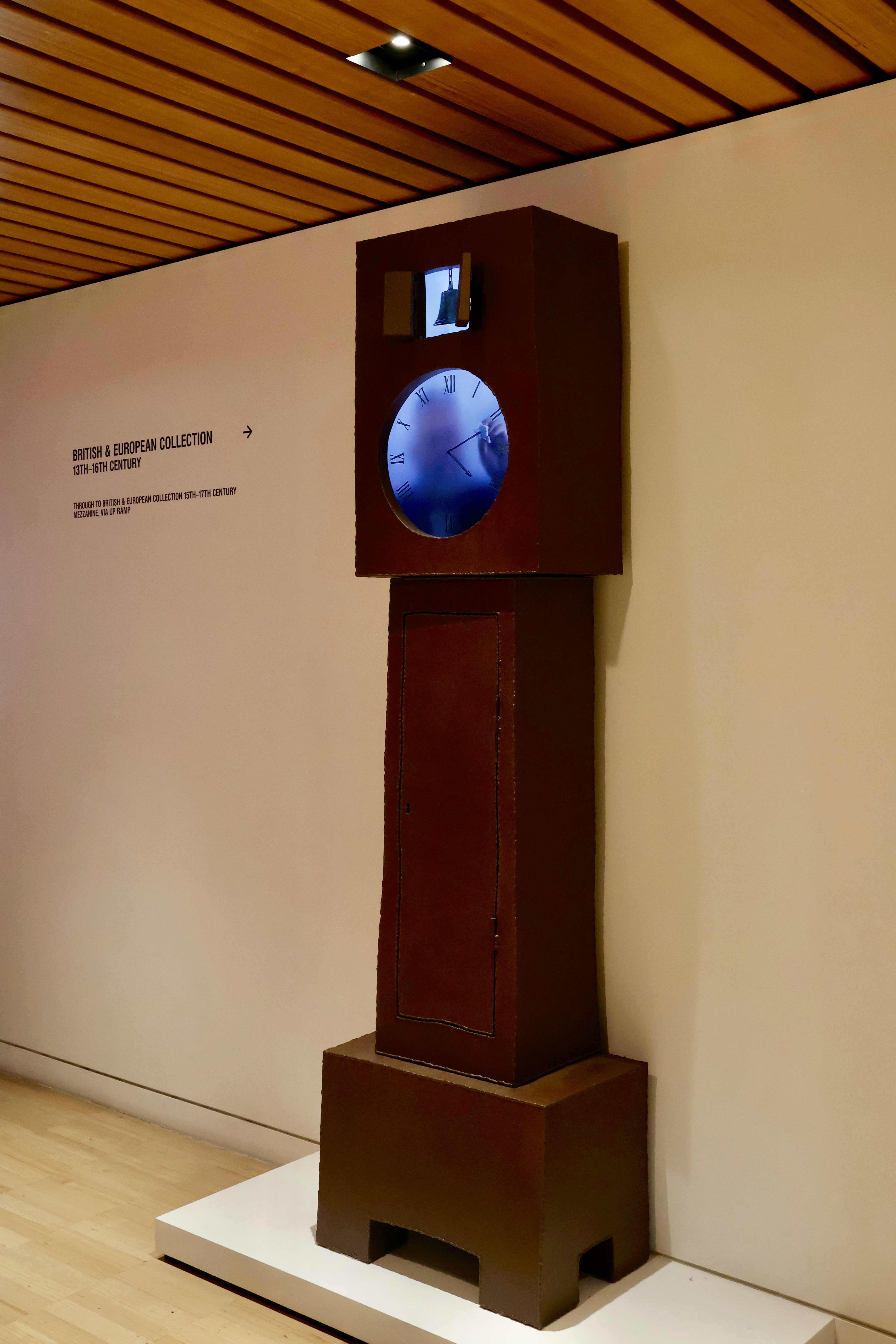 Clockwork Silence: A Minimalist Grandfather Clock in a Museum Gallery