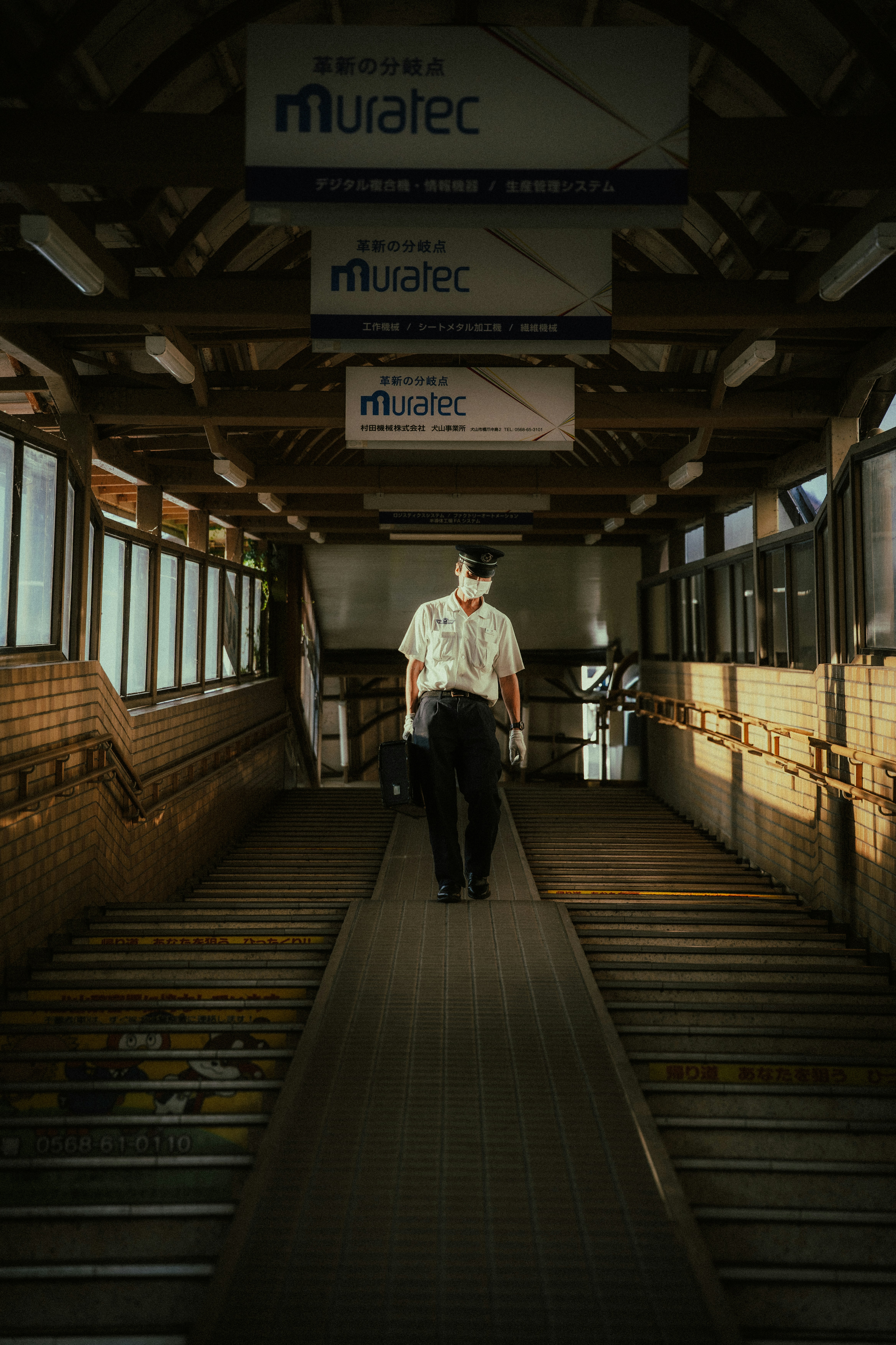 Crossing Silence: A Station Attendant Descends the Ramp