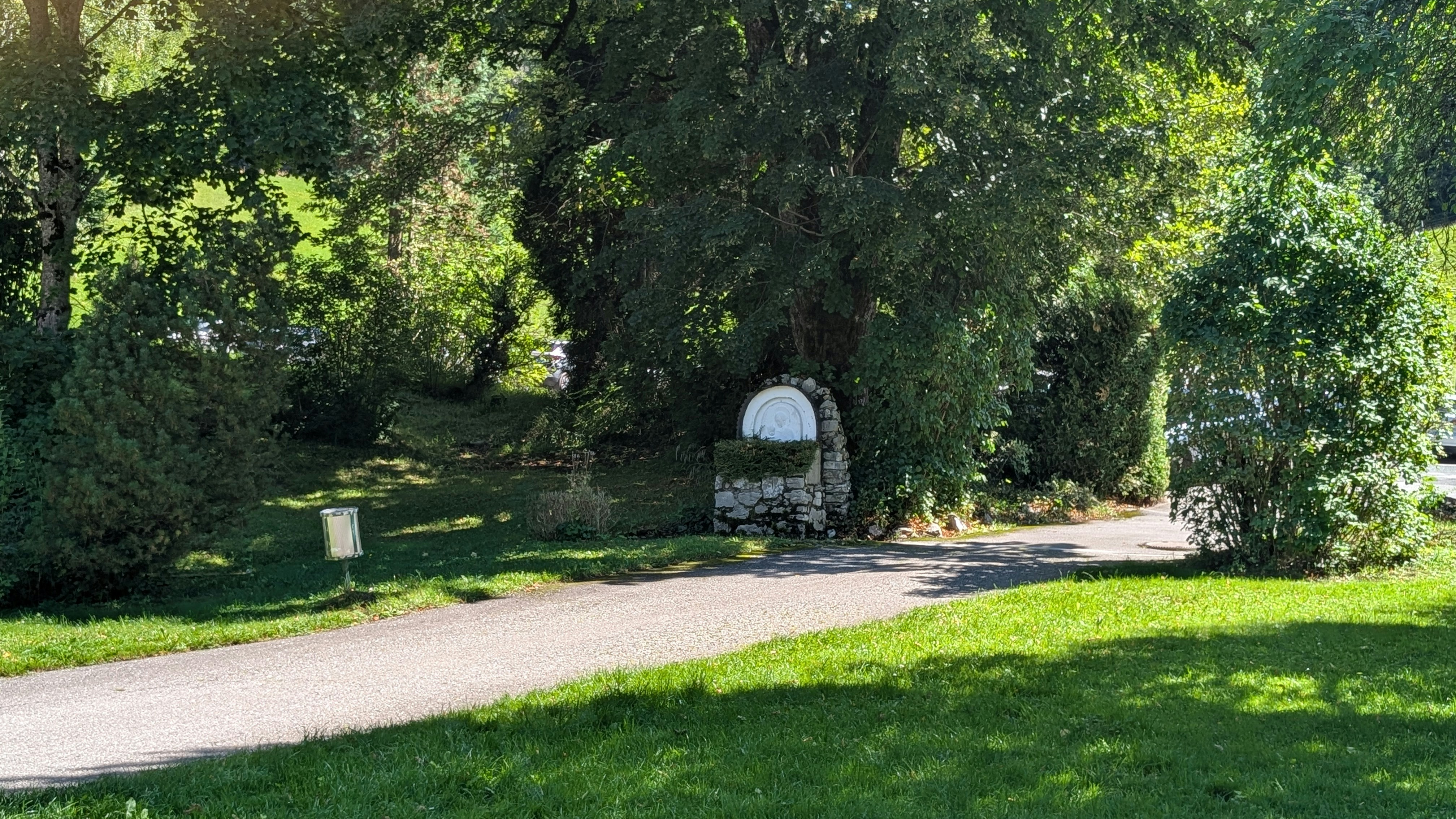 Arched Garden Portal at the End of a Sunlit Path