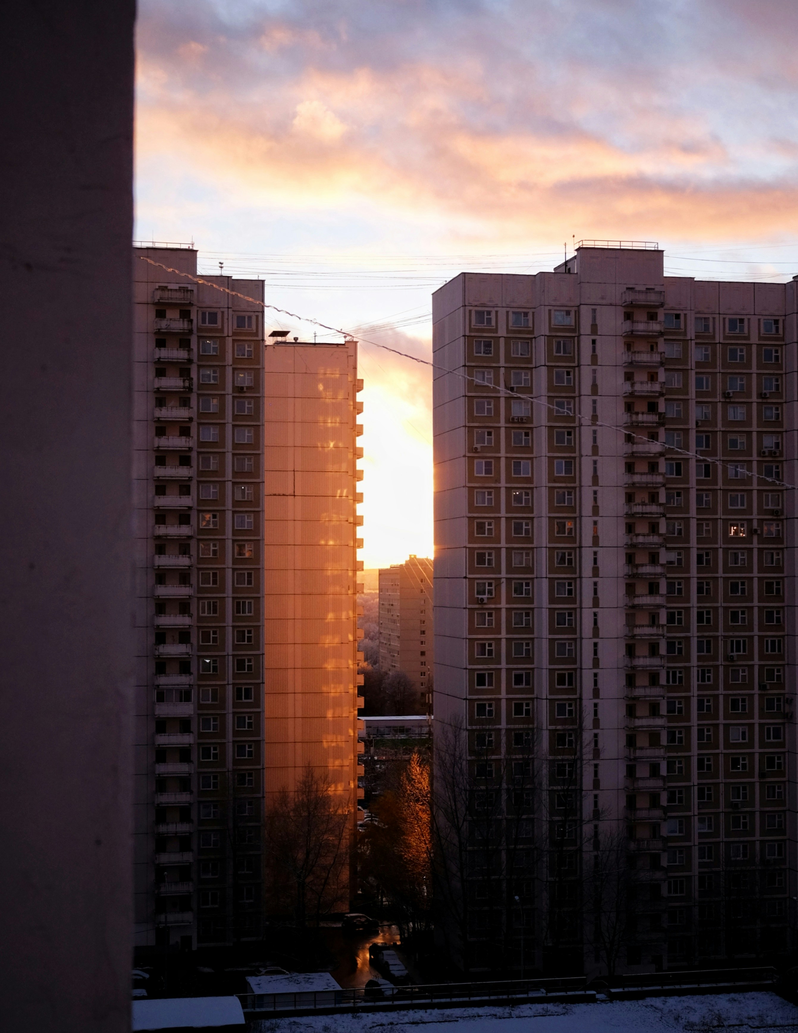 Sunlit Gaps Between Towers: Evening Light Through the City