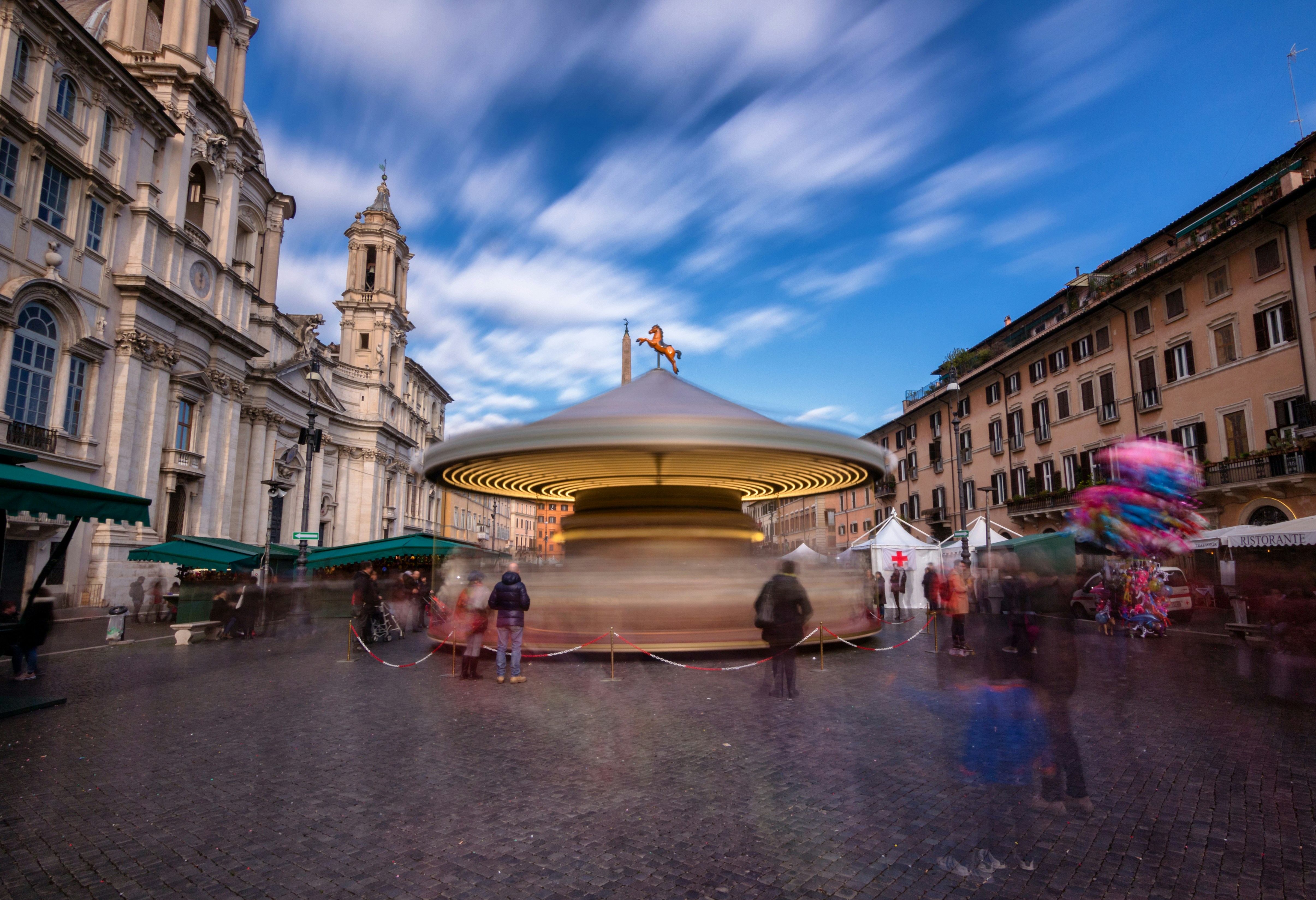 Central Carousel in Motion under a Sky of Bursting Clouds