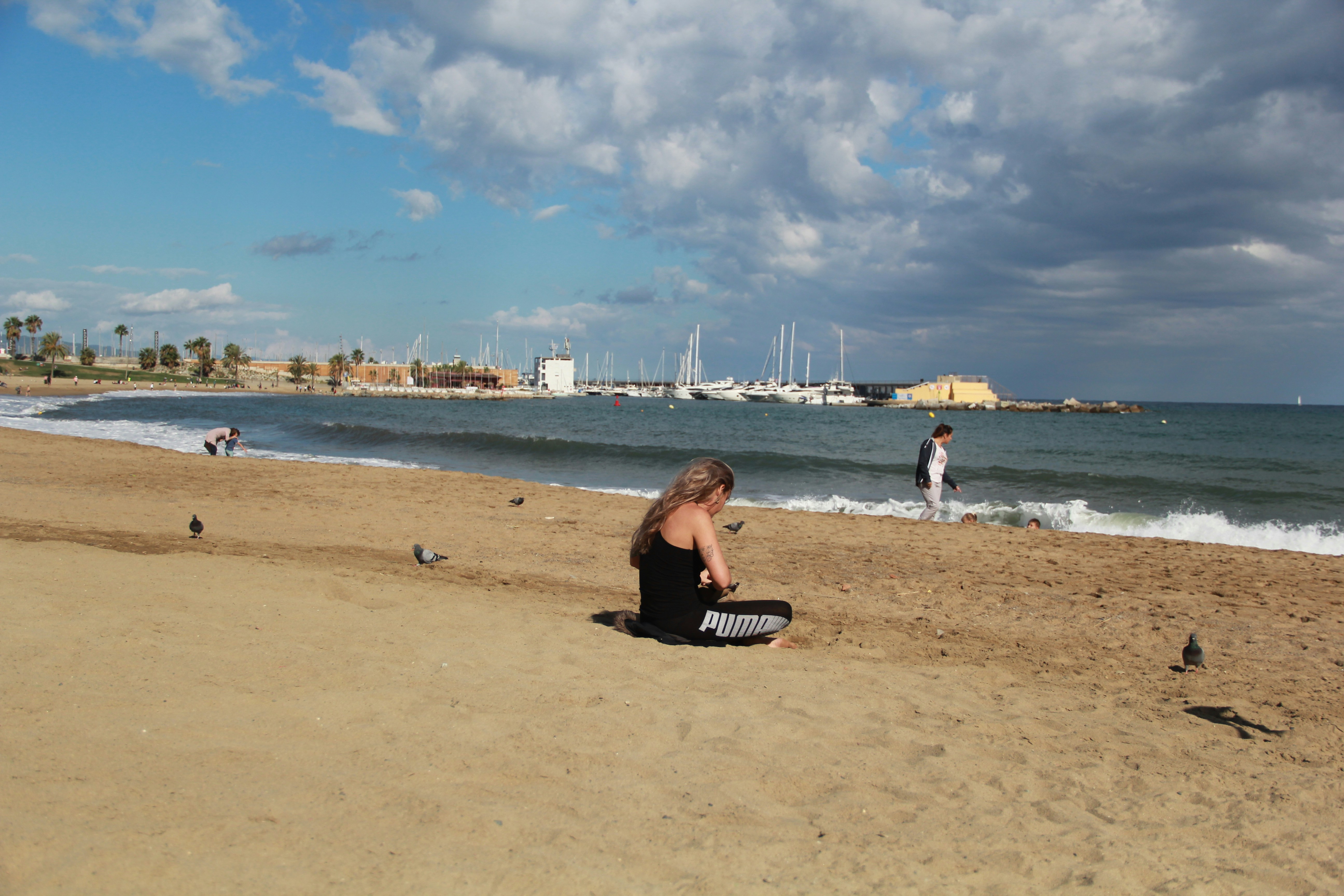 Sunlit sitter on a quiet Mediterranean beach