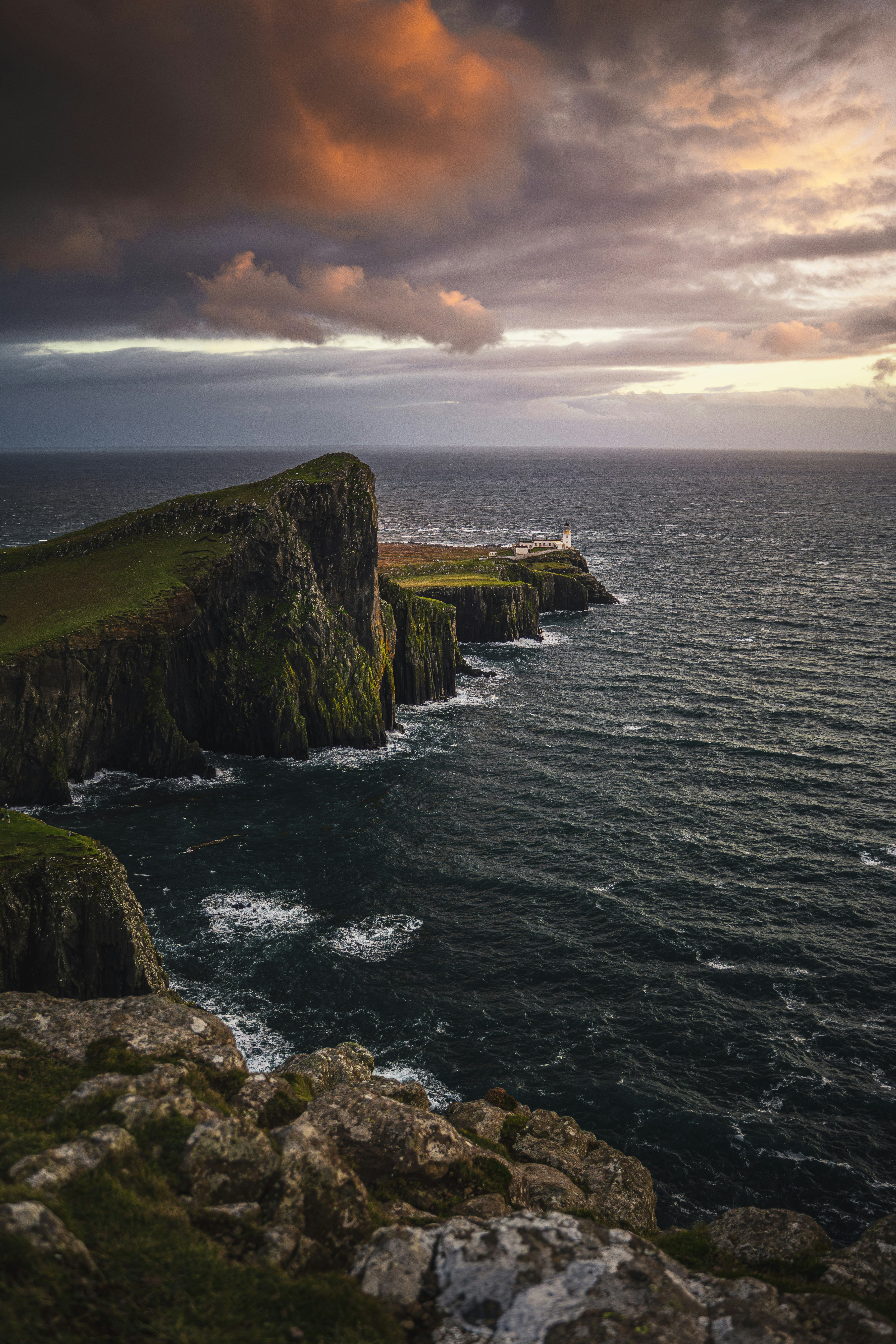 Dramatic cliffs meet the ocean under a stormy sky. photo – Free Travel ...