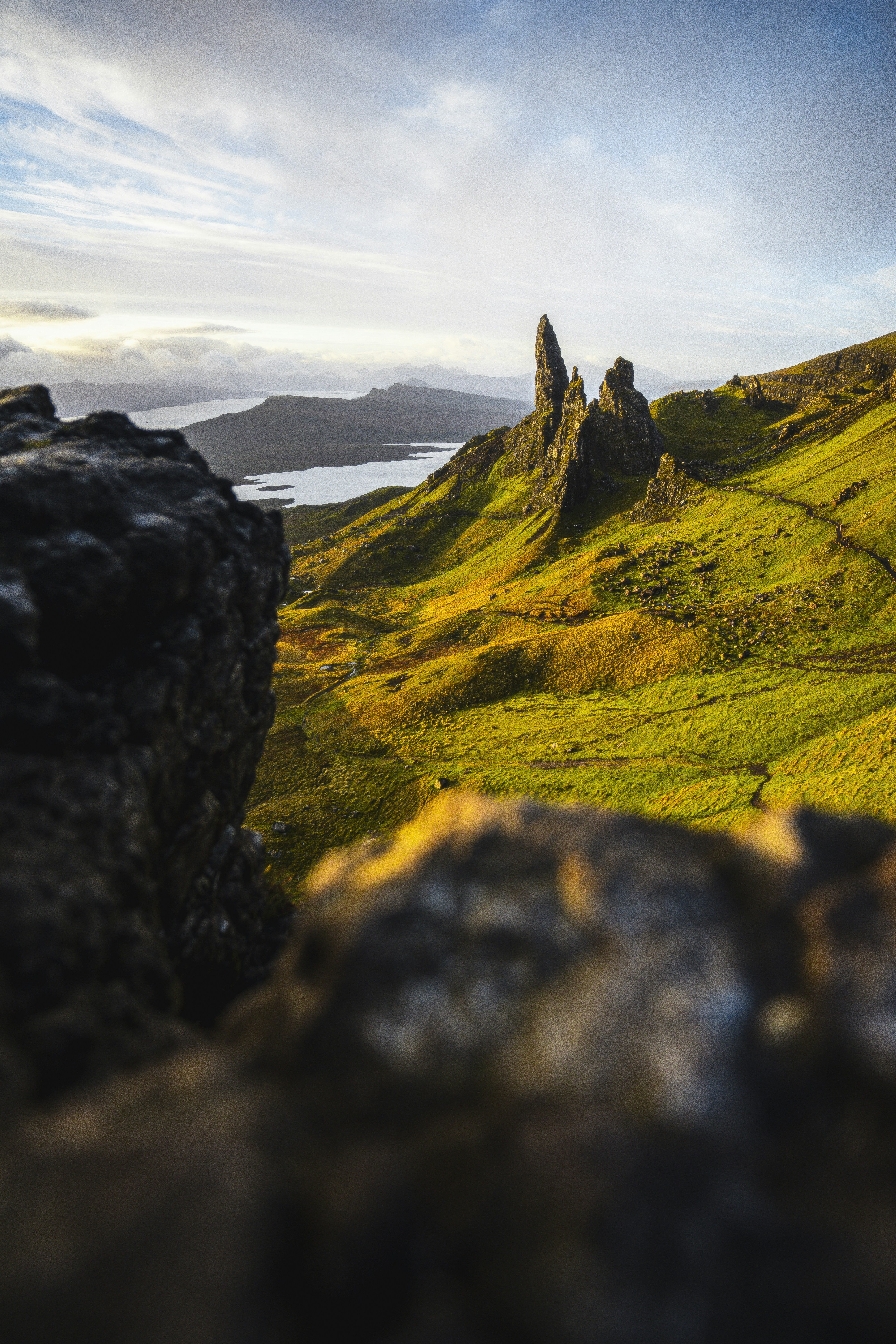 Jagged rock formations on a green, rolling hillside. photo – Free ...