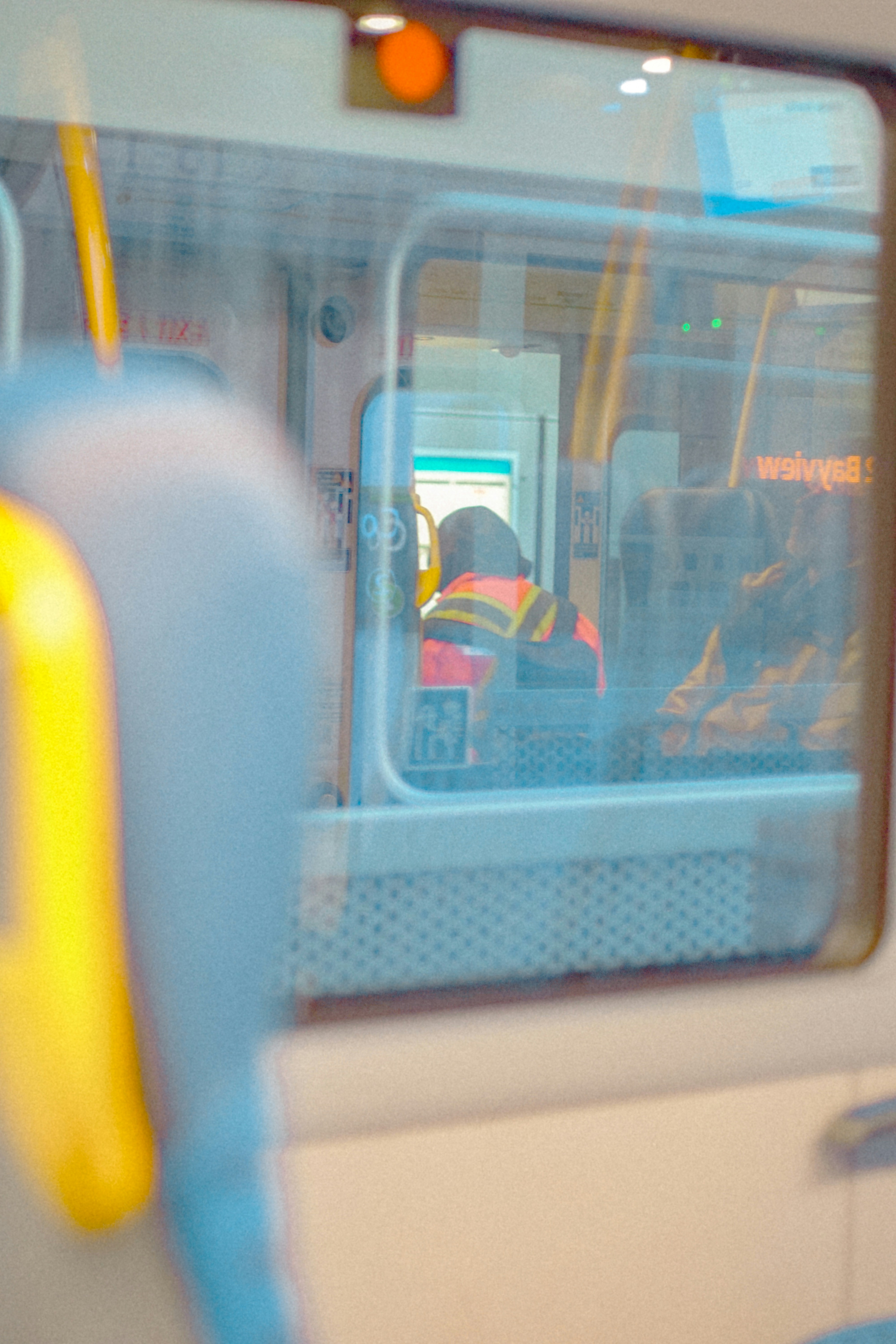 Inside the Quiet Bus: A Glimpse Through a Windowed Cabin