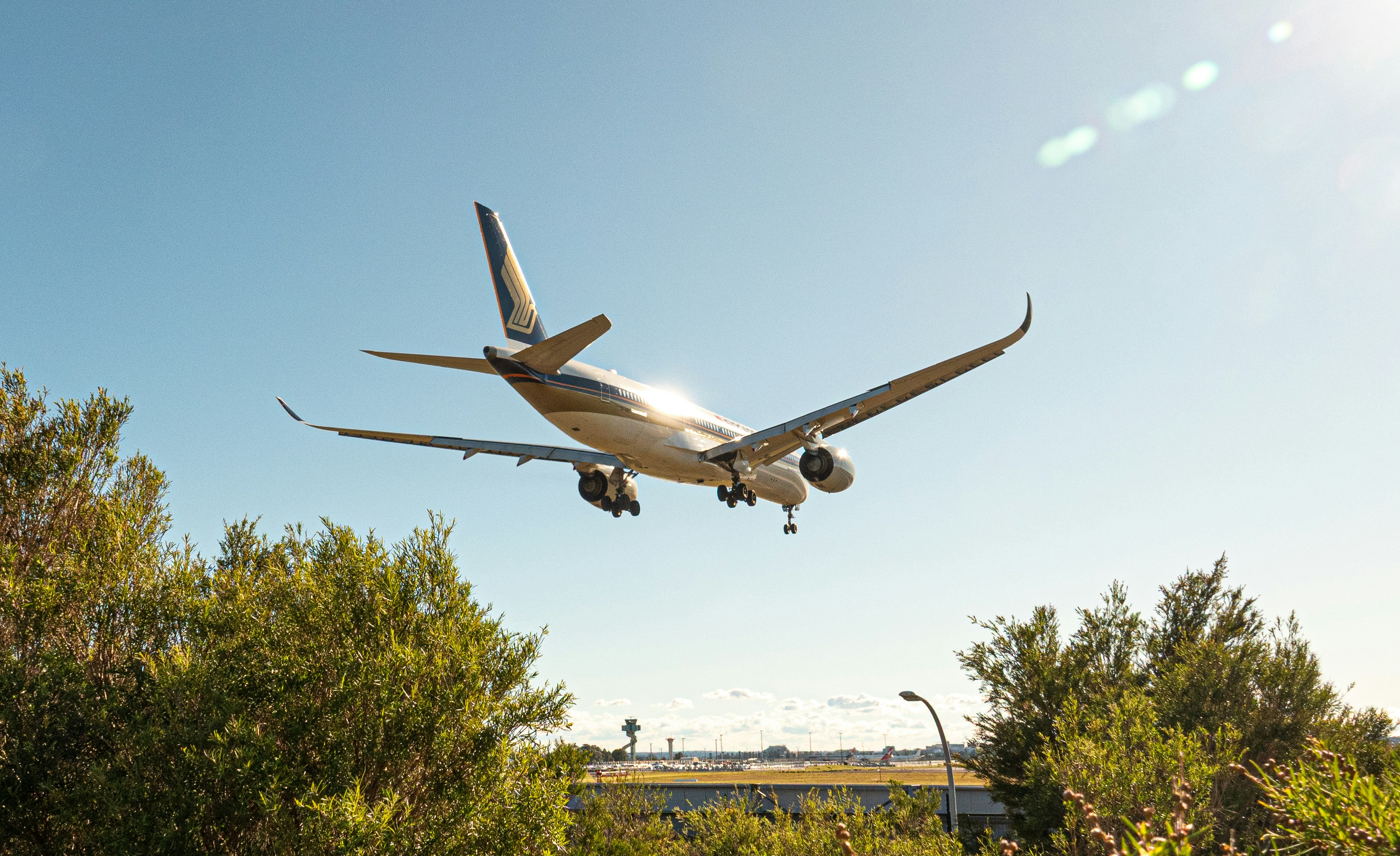 Approaching Touchdown: A Wide-Body Flight Descends Through a Clear Sky