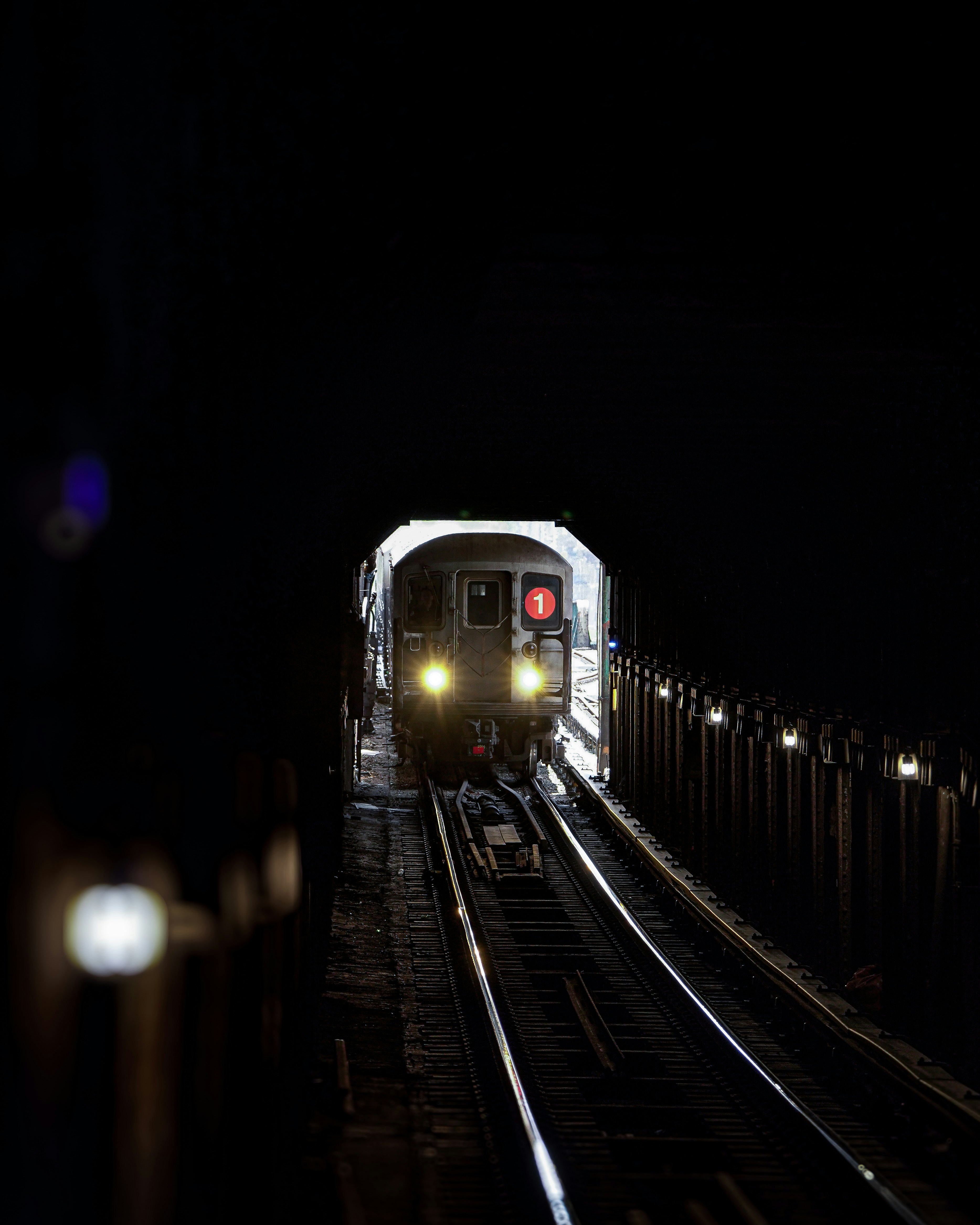 Midnight Liner: Headlights Pierce a Quiet Tunnel