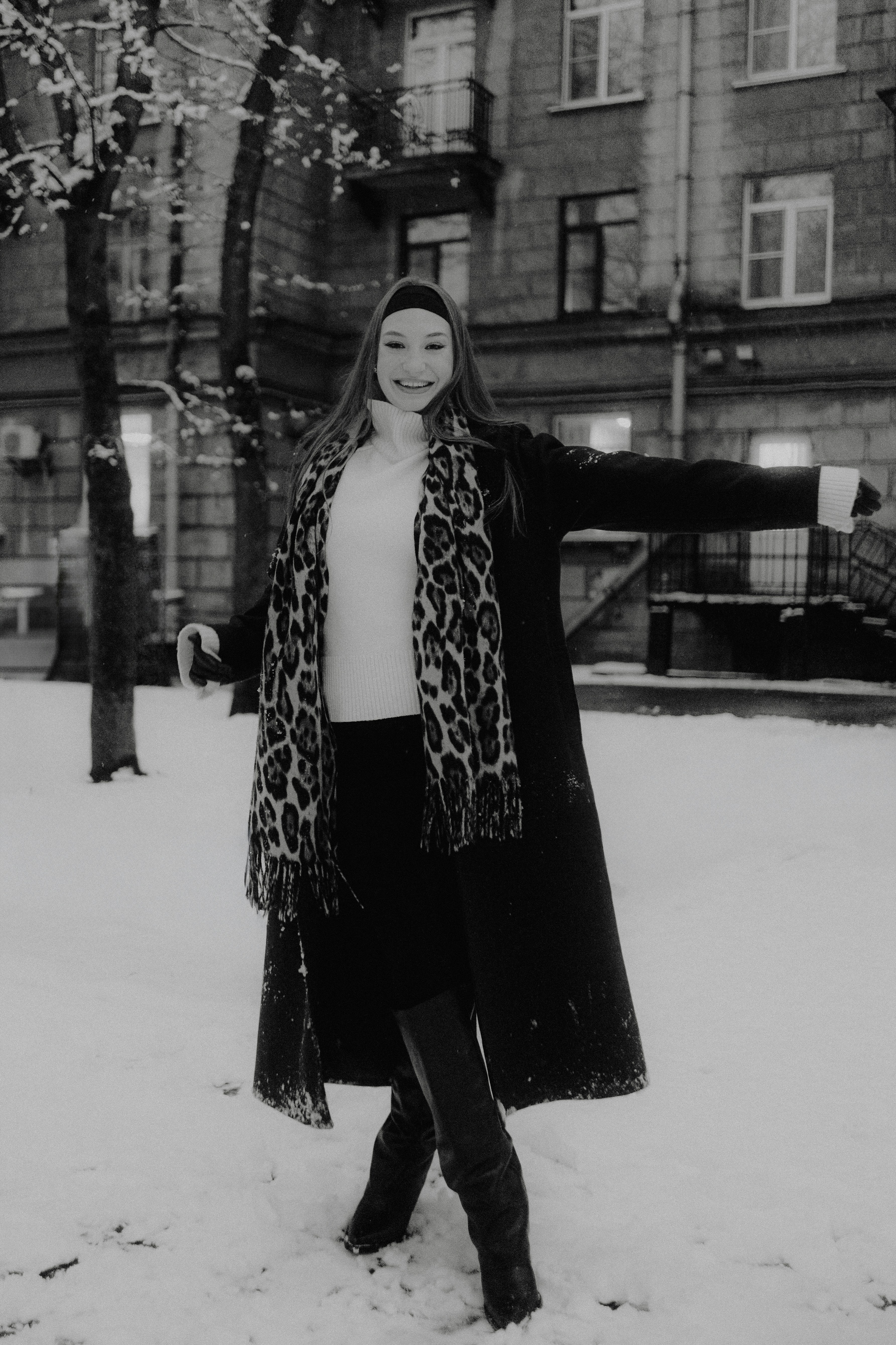 Winter Welcome: A Portrait in Snow Outside a City Block