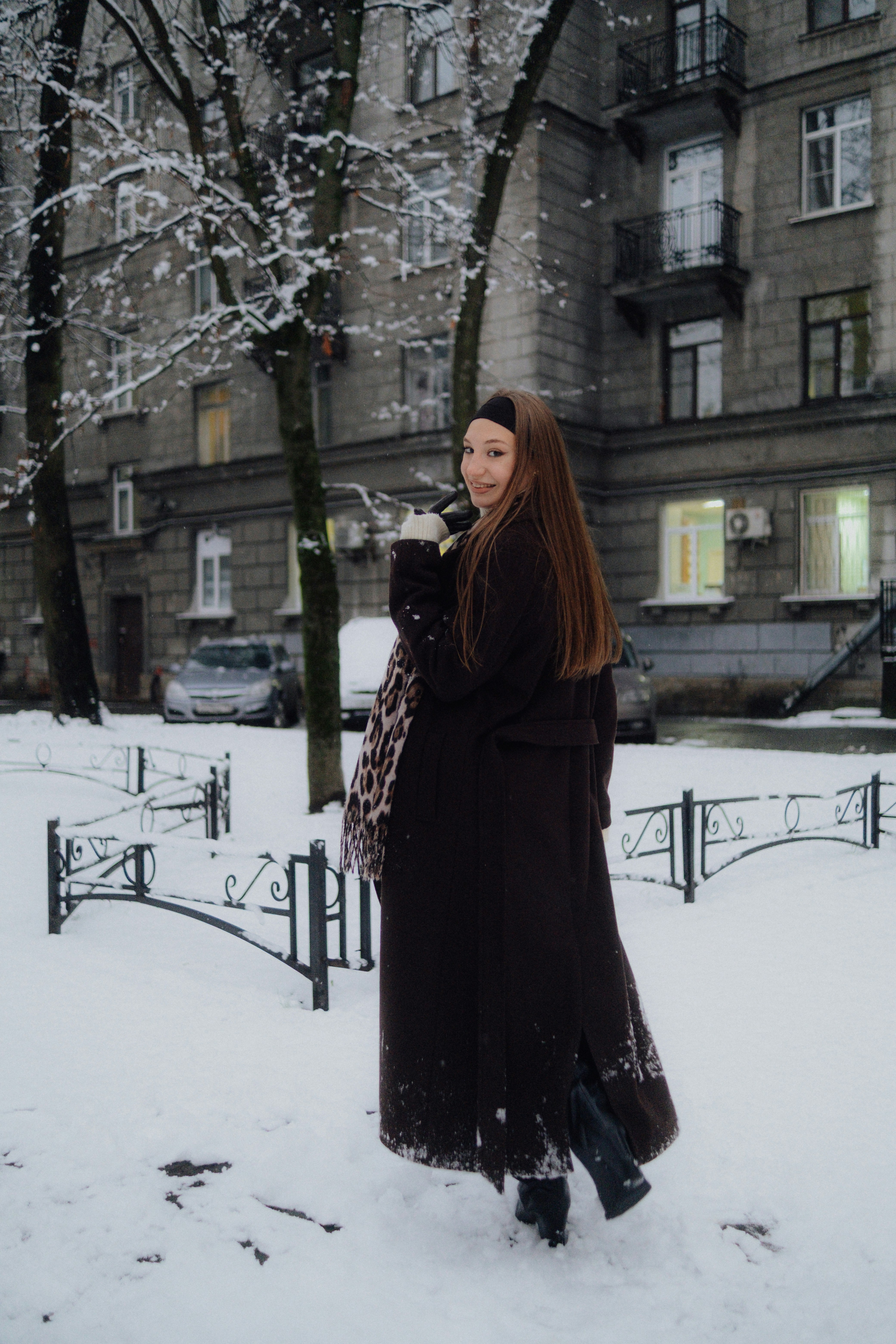 Snowy Street Portrait: A Warm Smile in Winter Light