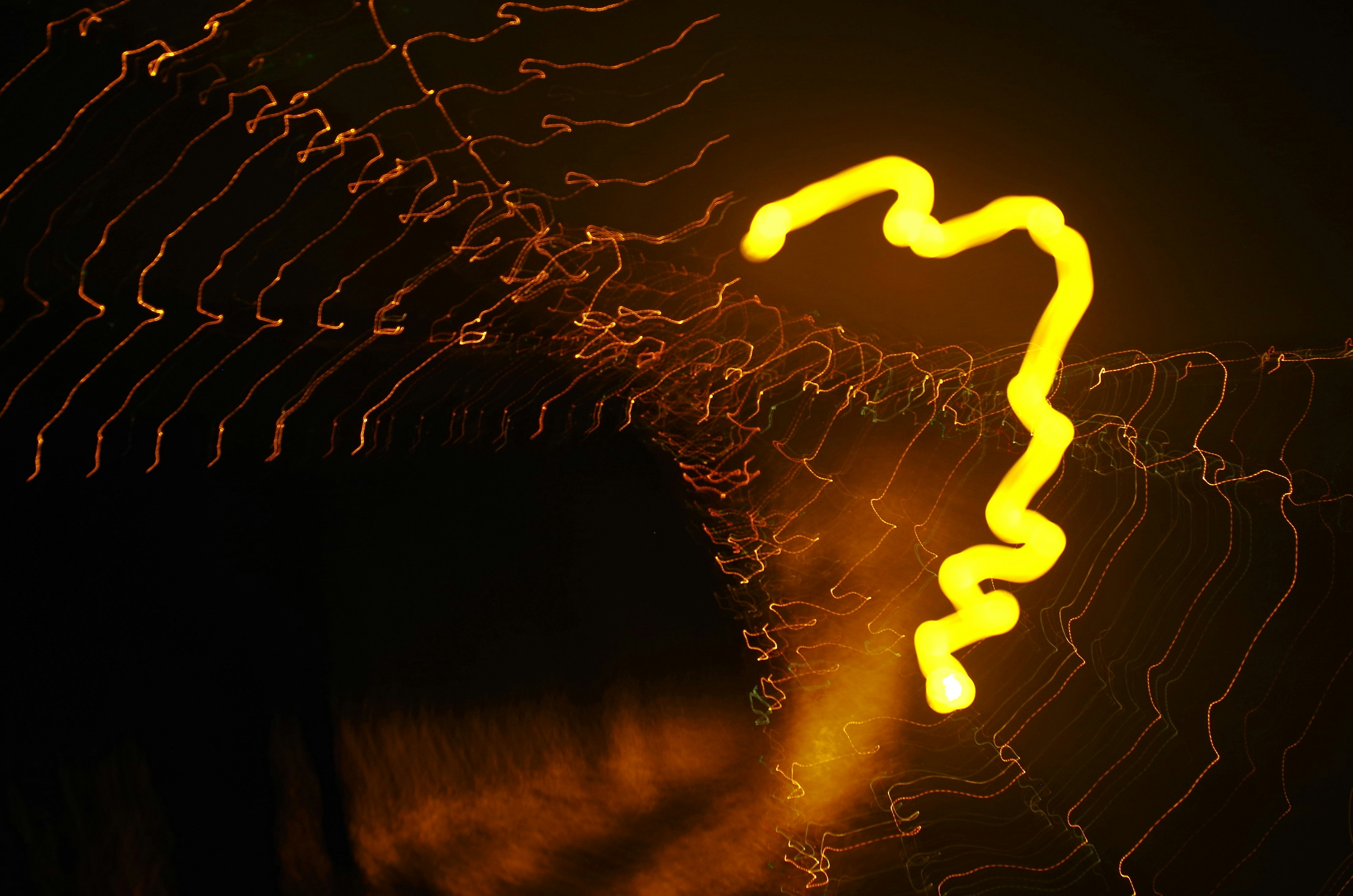 Neon Whirl: A Long-Exposure Dance of Light Trails